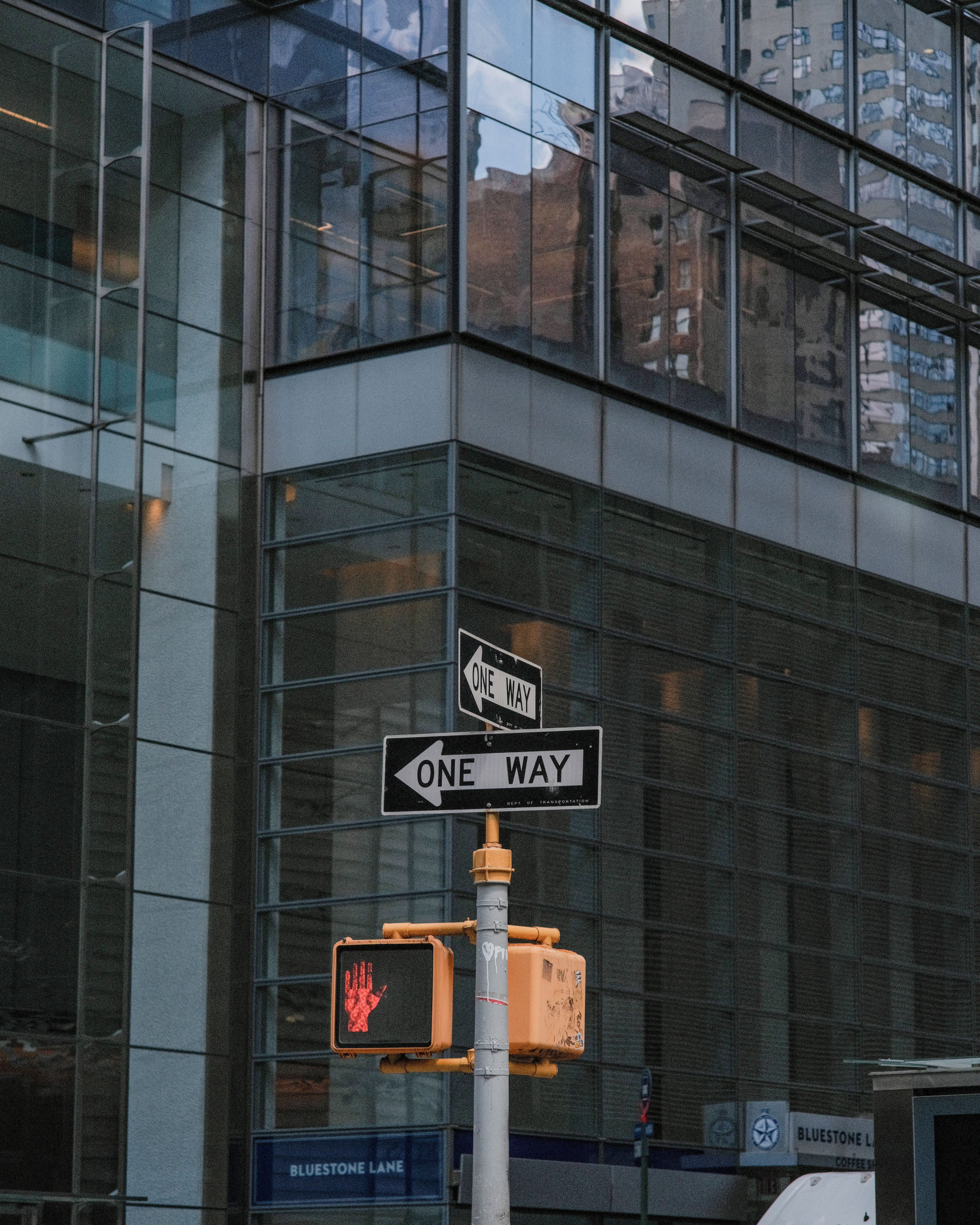 View of a Sign and Traffic Light in Front of a Building in New York ...
