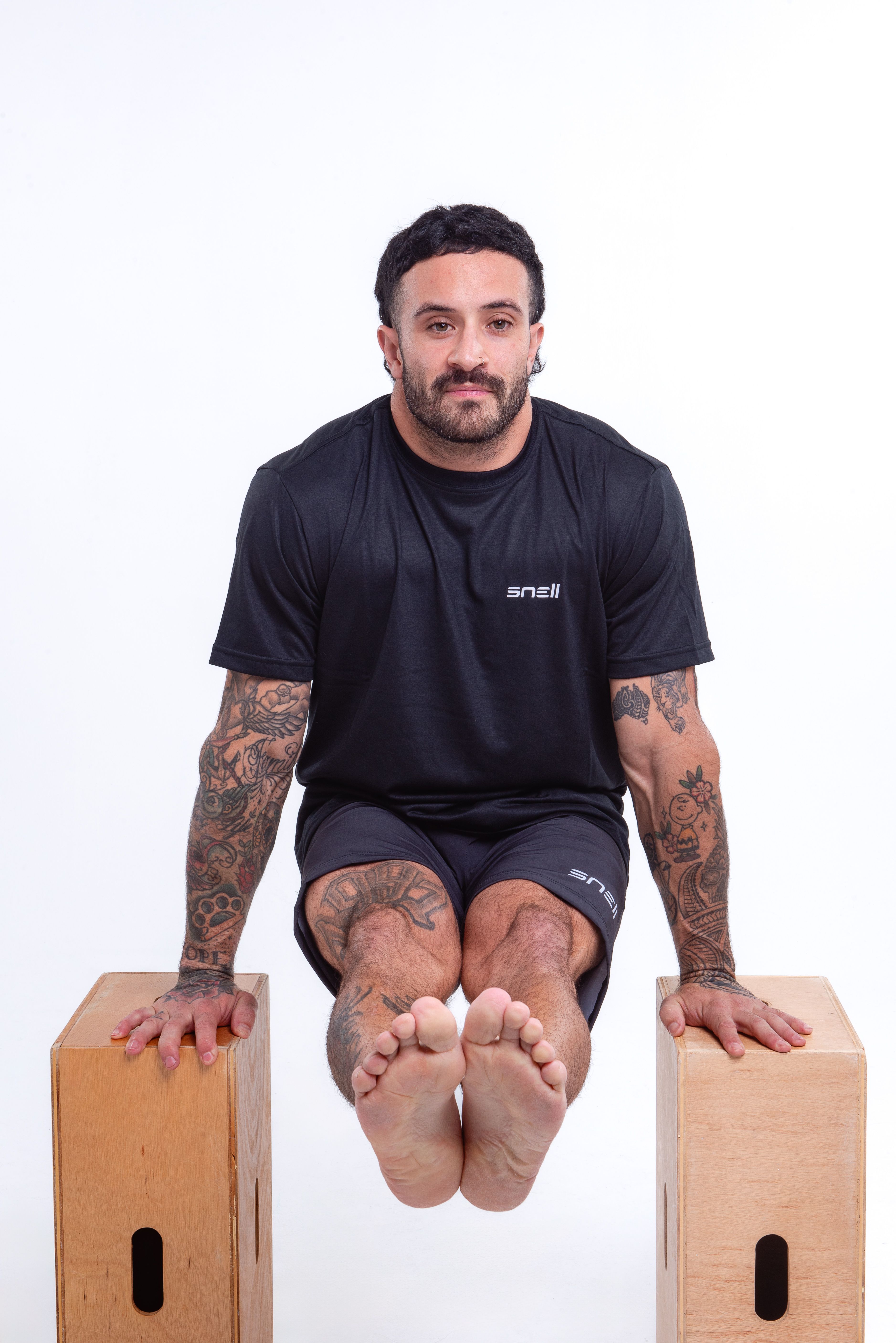 Studio Portrait of a Man Doing Leg Raises on Two Wooden Boxes · Free ...