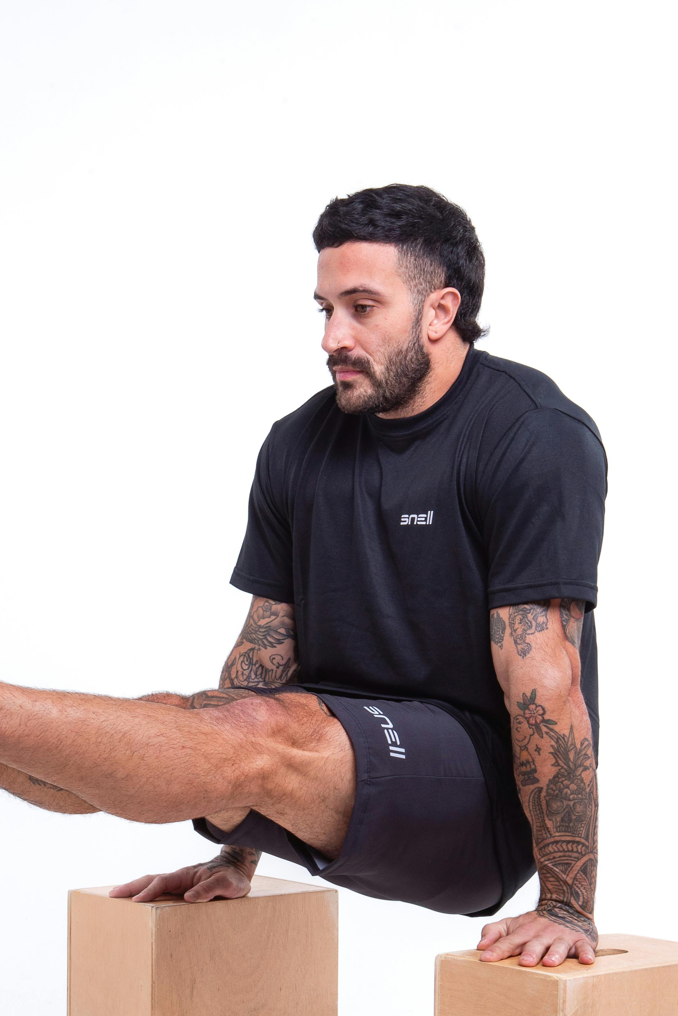 Studio Portrait of a Man Doing Leg Raises on Two Wooden Boxes · Free ...