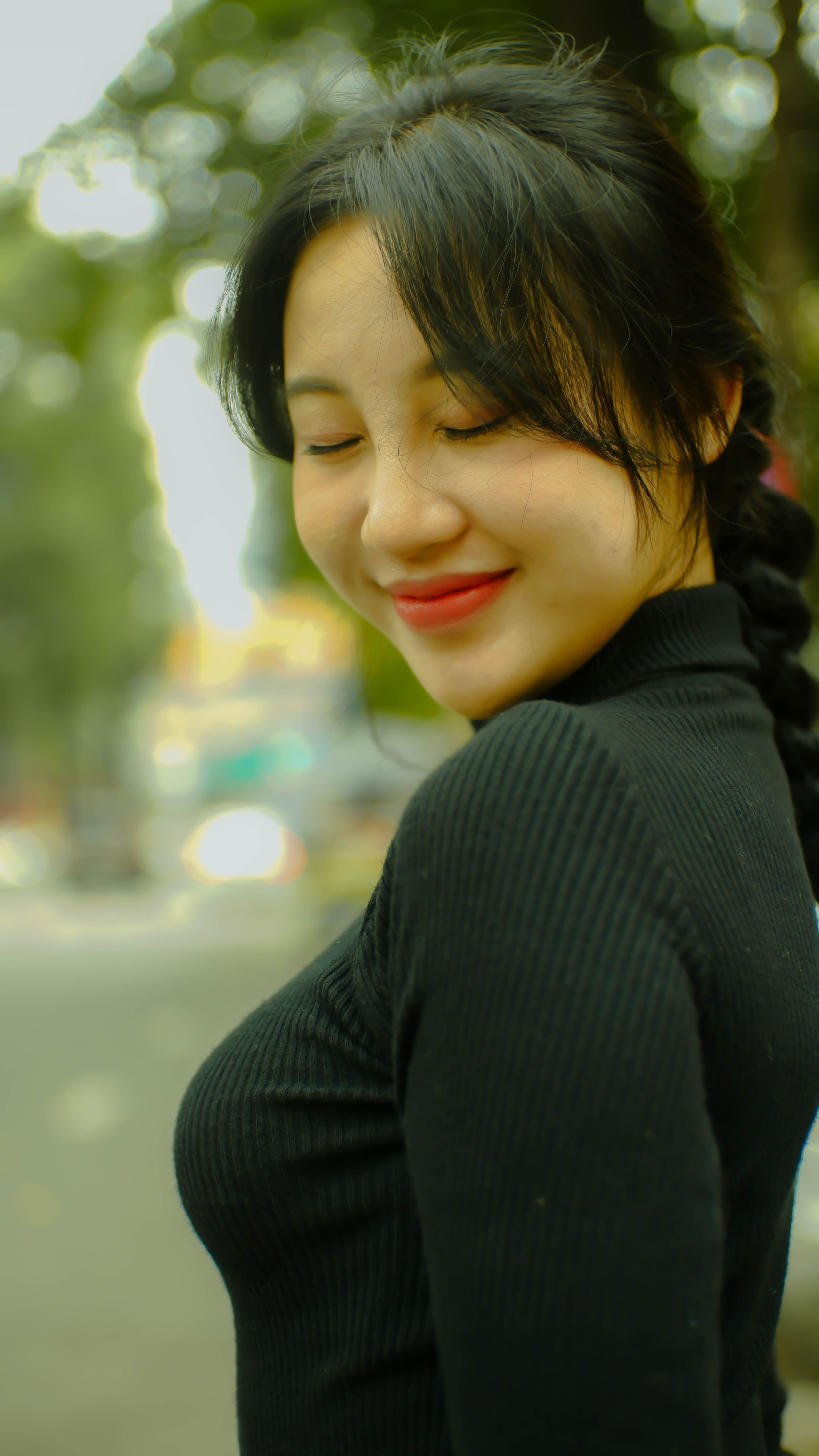 Smiling Young Woman with Closed Eyes · Free Stock Photo