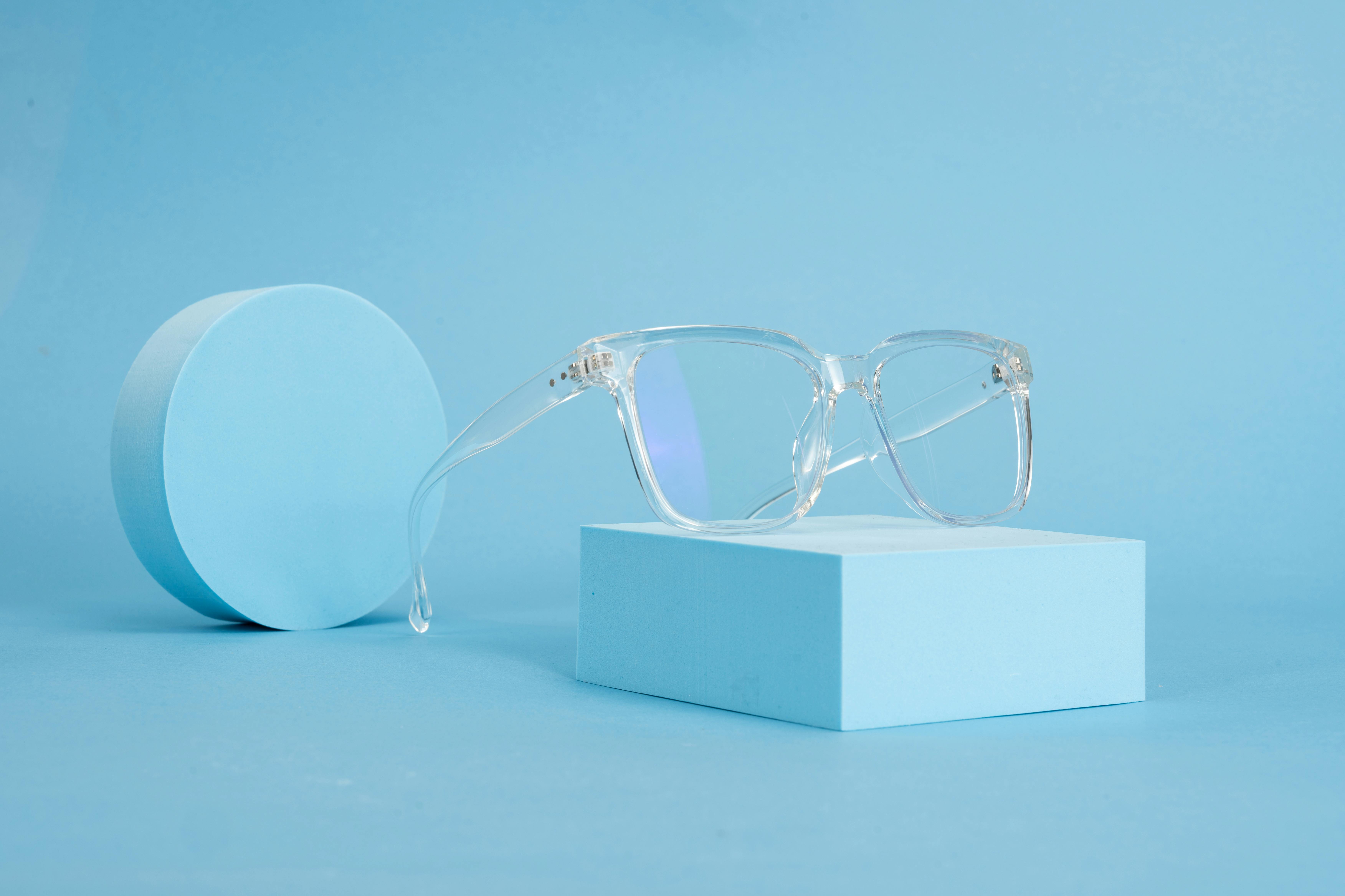 Eyeglasses on Cube on Blue Background · Free Stock Photo