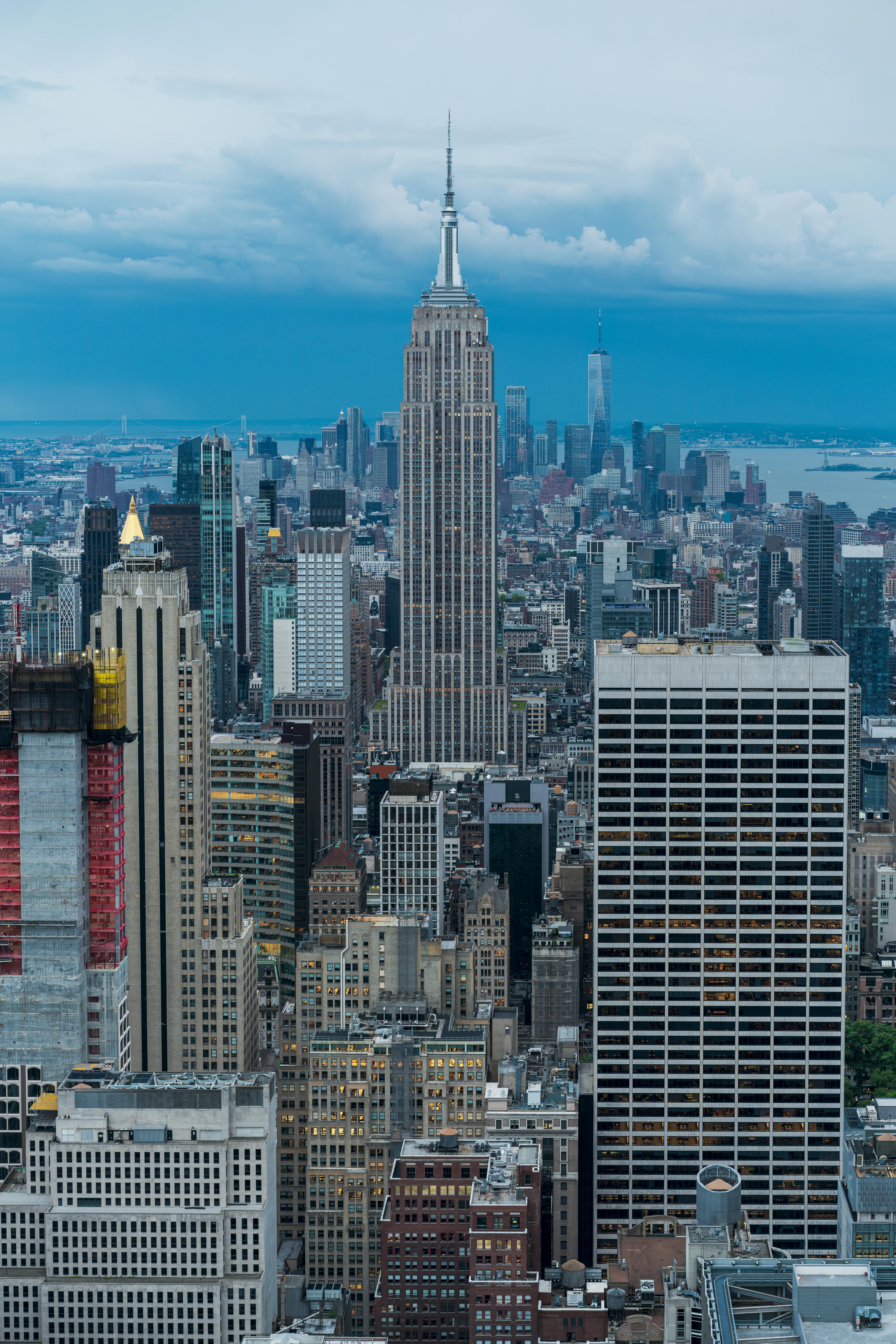 A Woman Sitting on Window Sill at the Top of The Rock in New York City ...