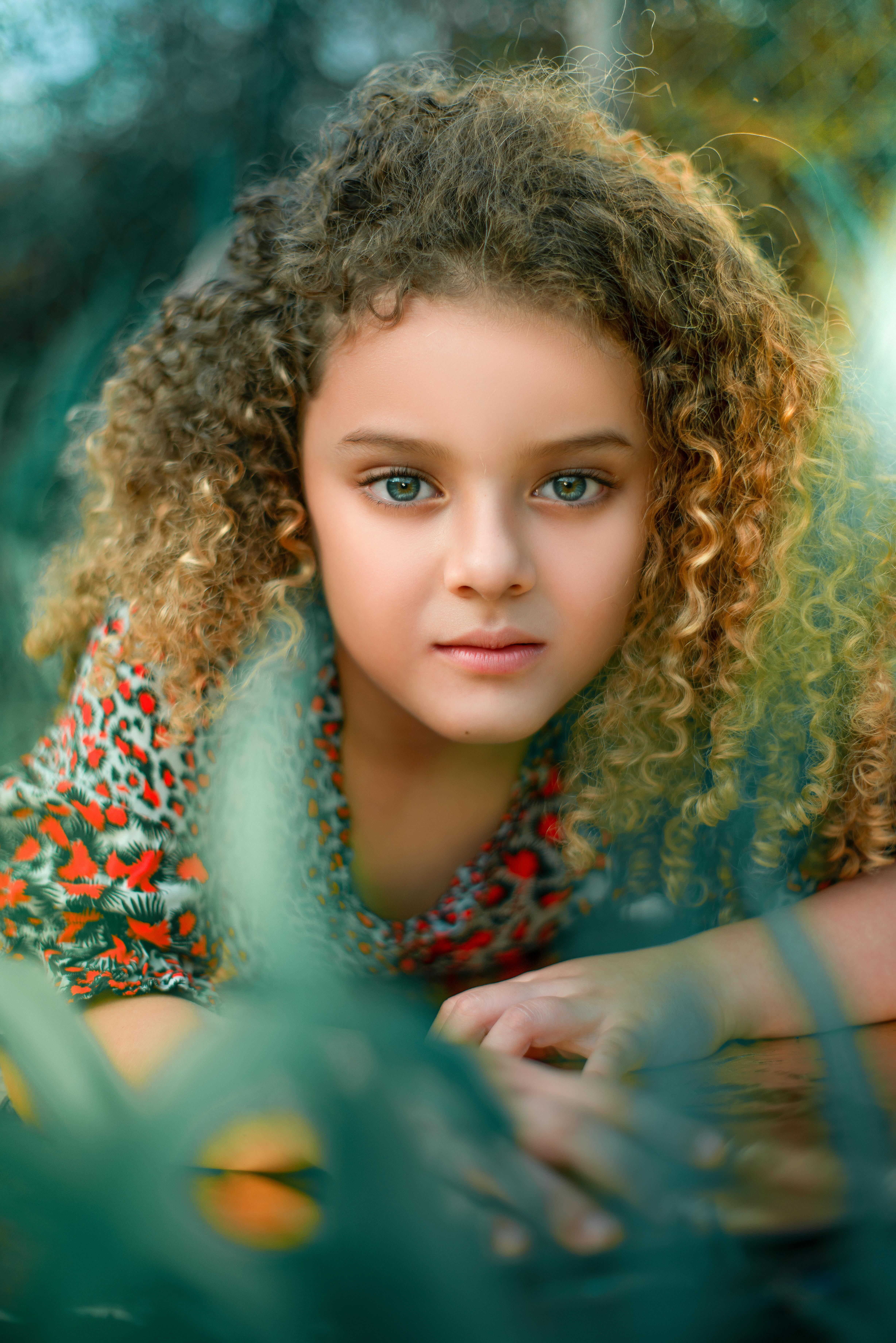 Face of Child Model in Floral pattern Dress · Free Stock Photo