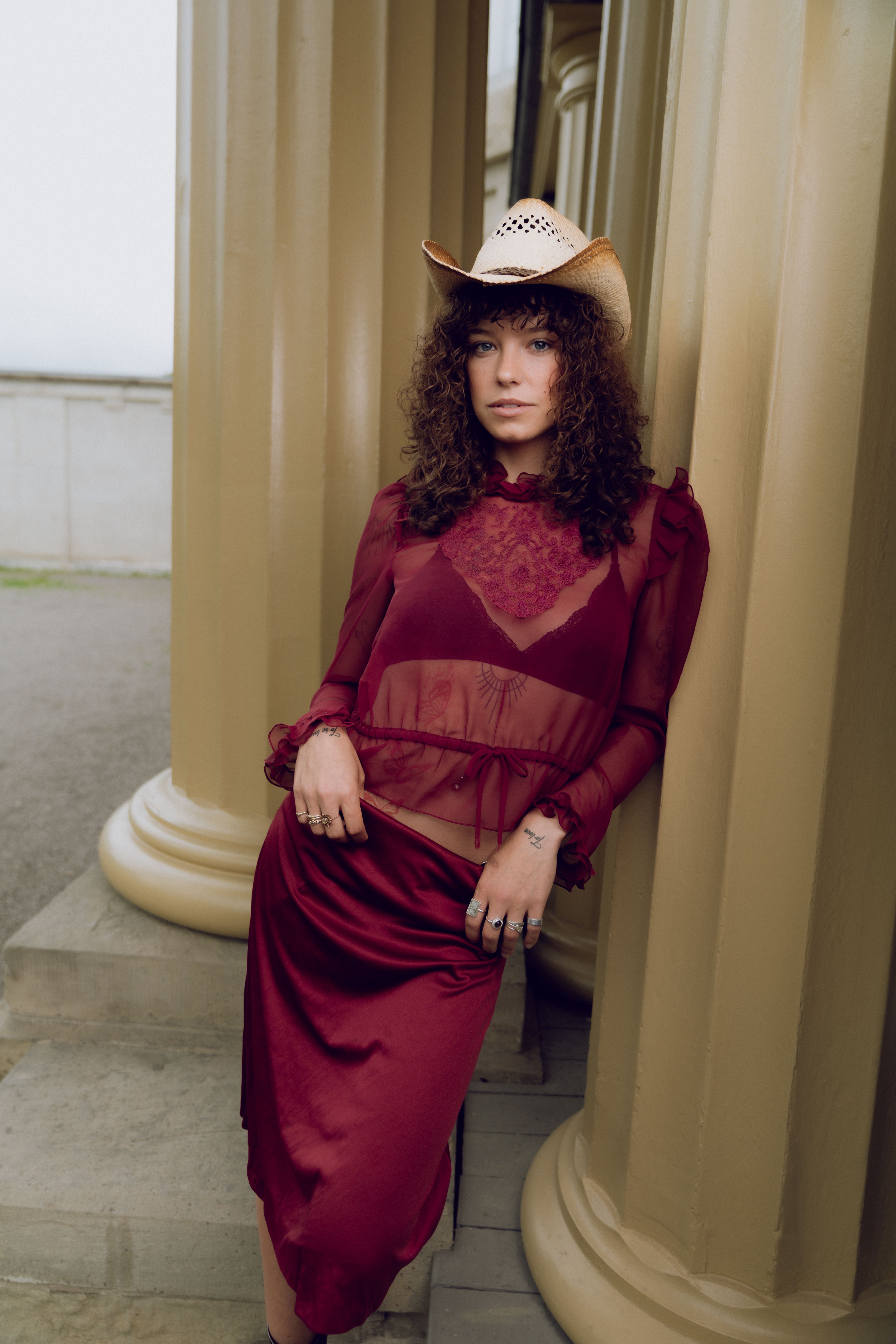 A woman in a red dress and cowboy hat · Free Stock Photo