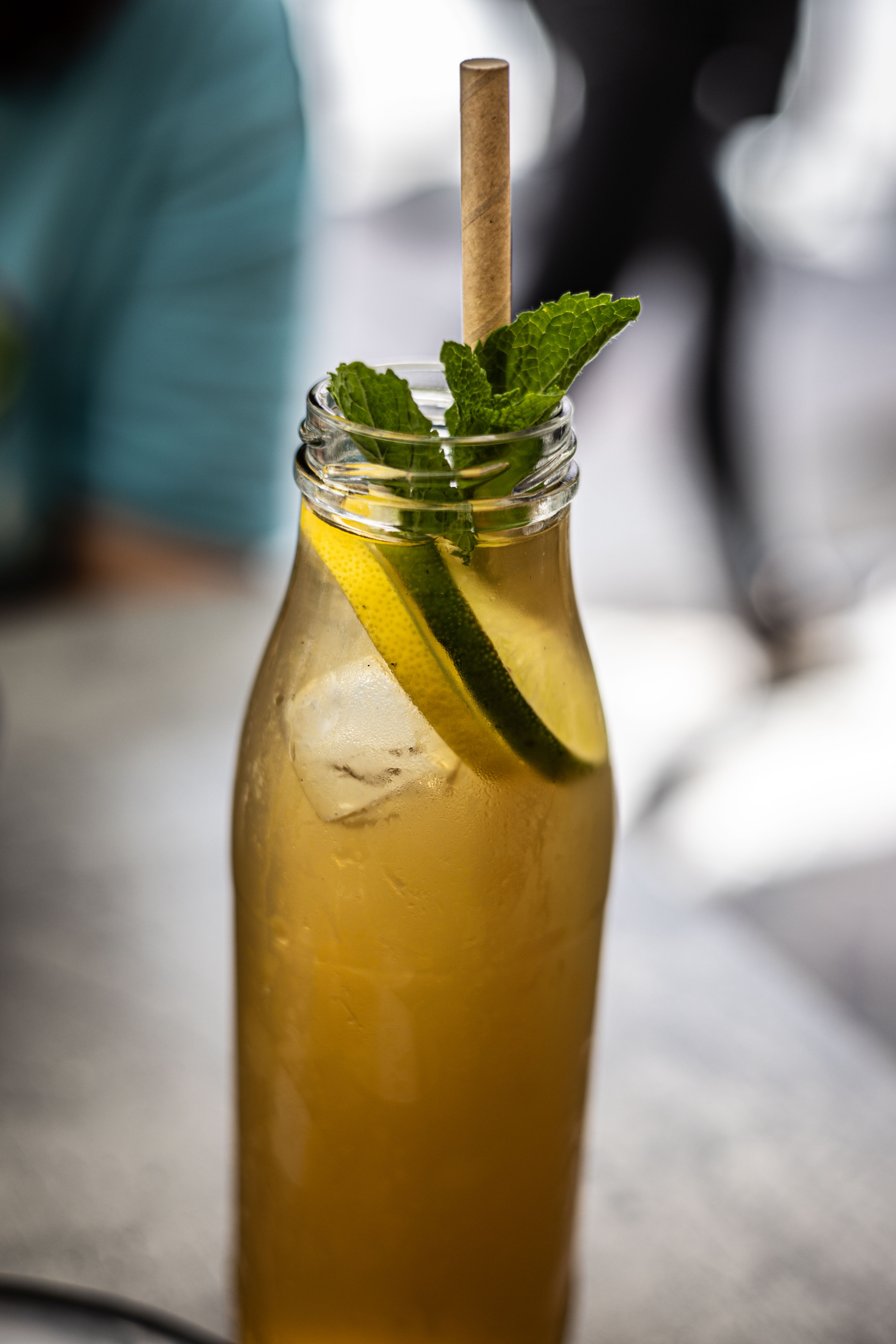 Slices of Lime and Leaves on a Glass Container with Lemonade · Free ...