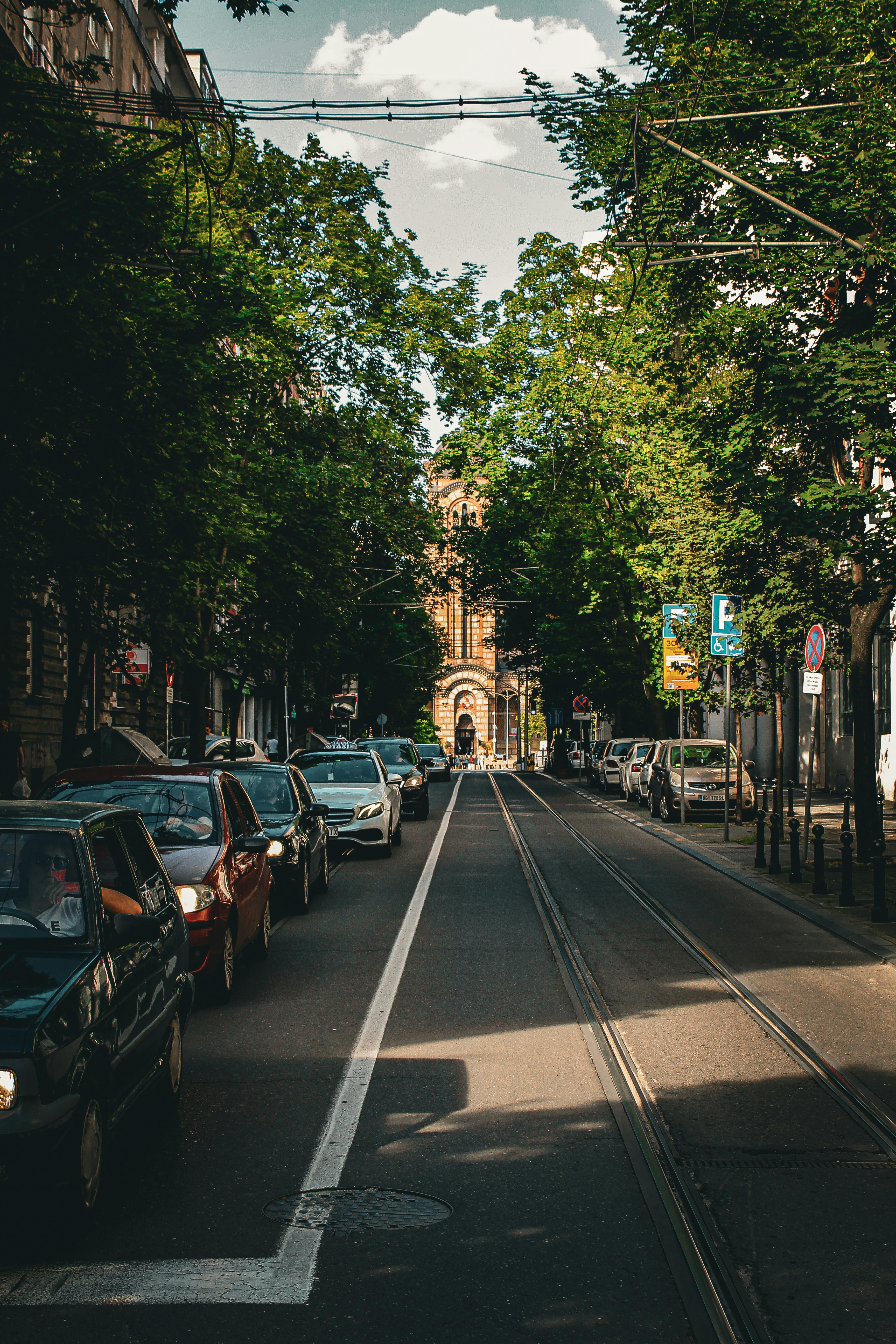 Cars on Street with Tram Tracks in City · Free Stock Photo