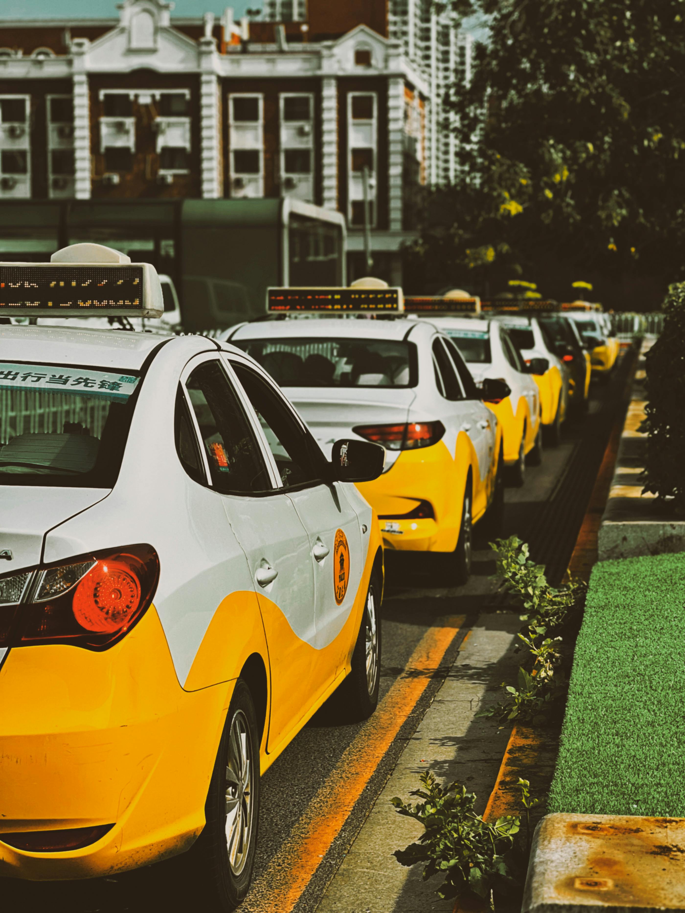 Taxi Cars on Street in City · Free Stock Photo