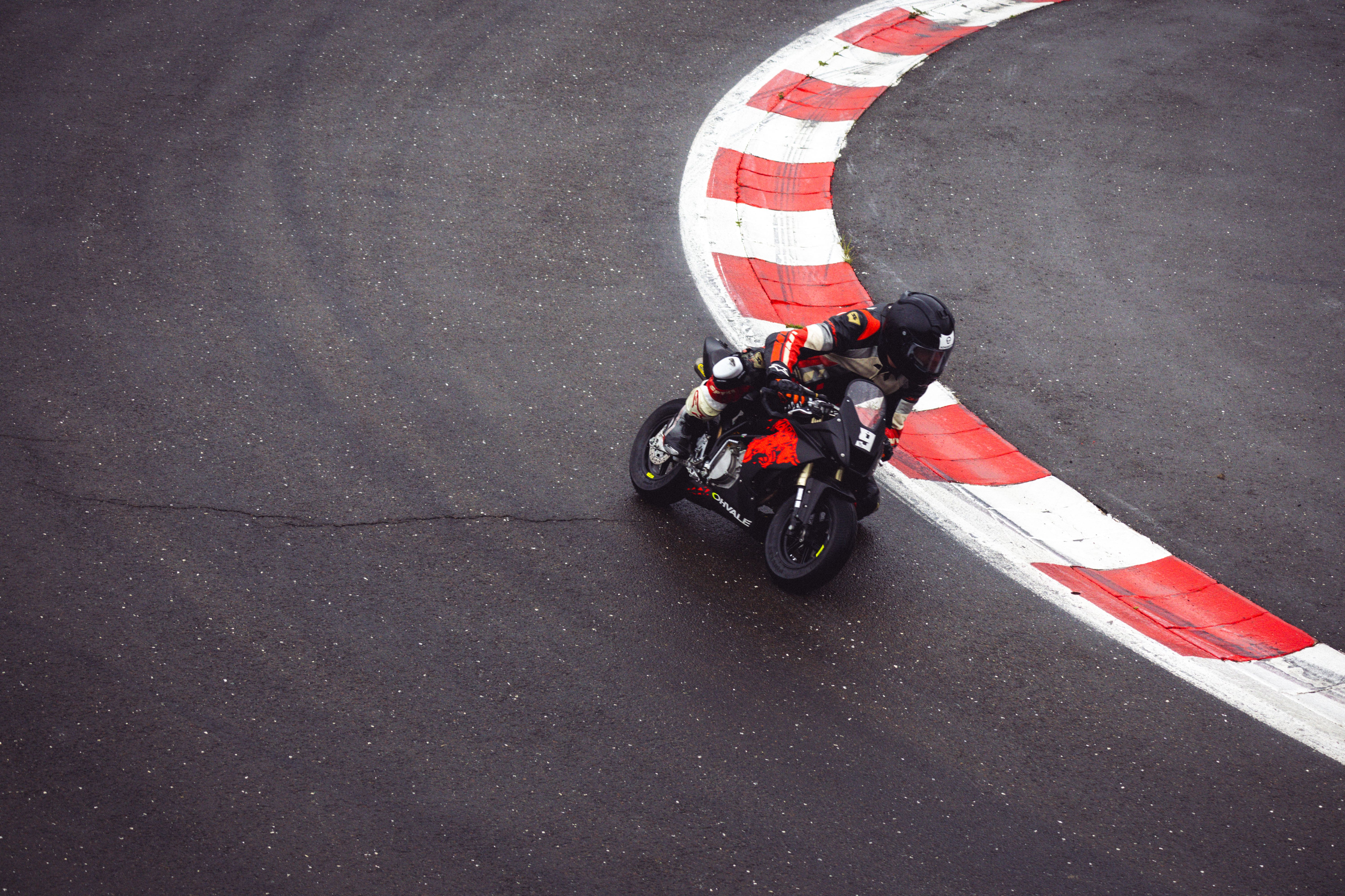 Rider with Helmet on Motorcycle on Race Track · Free Stock Photo