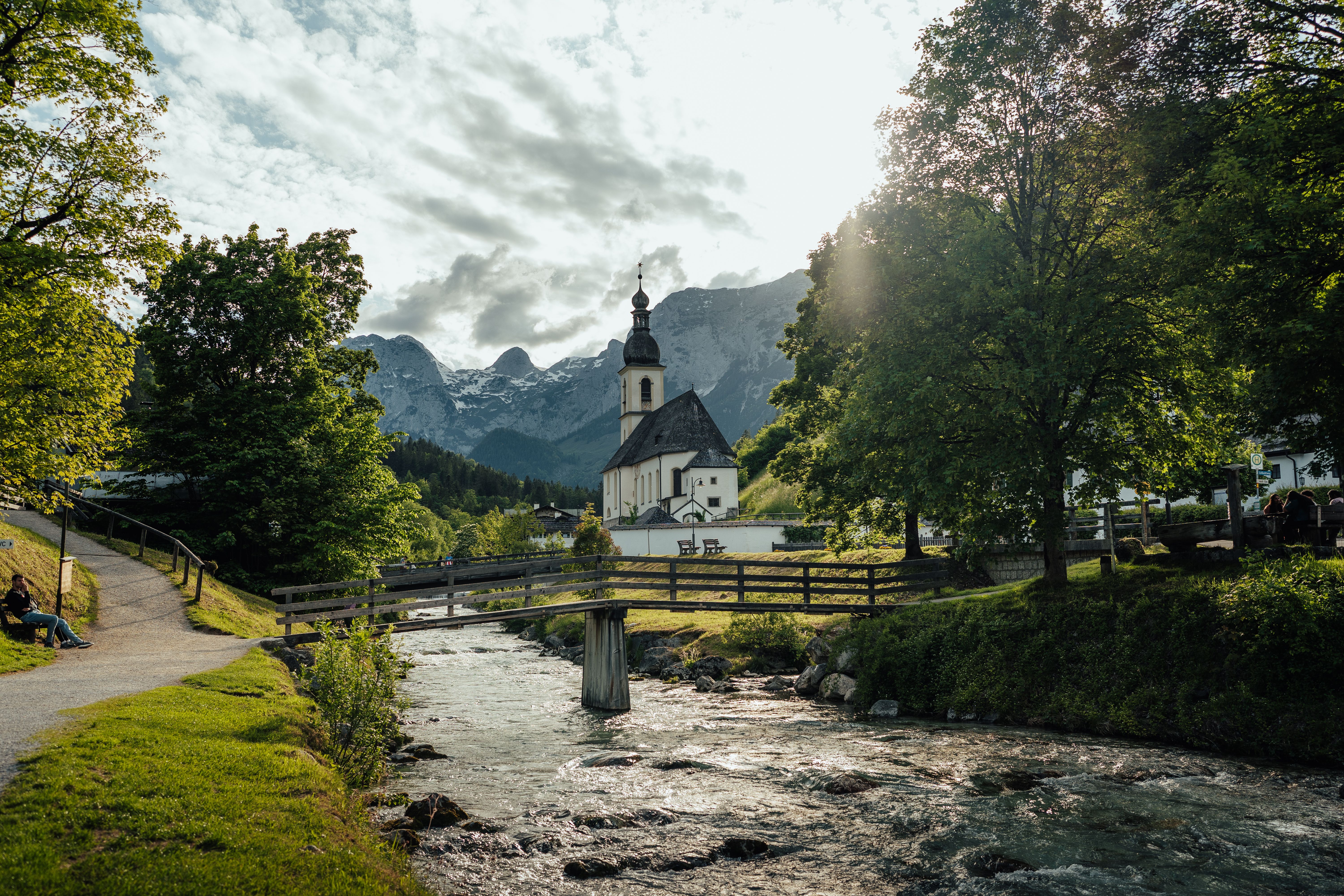 A church in the mountains with a river running through it · Free Stock ...