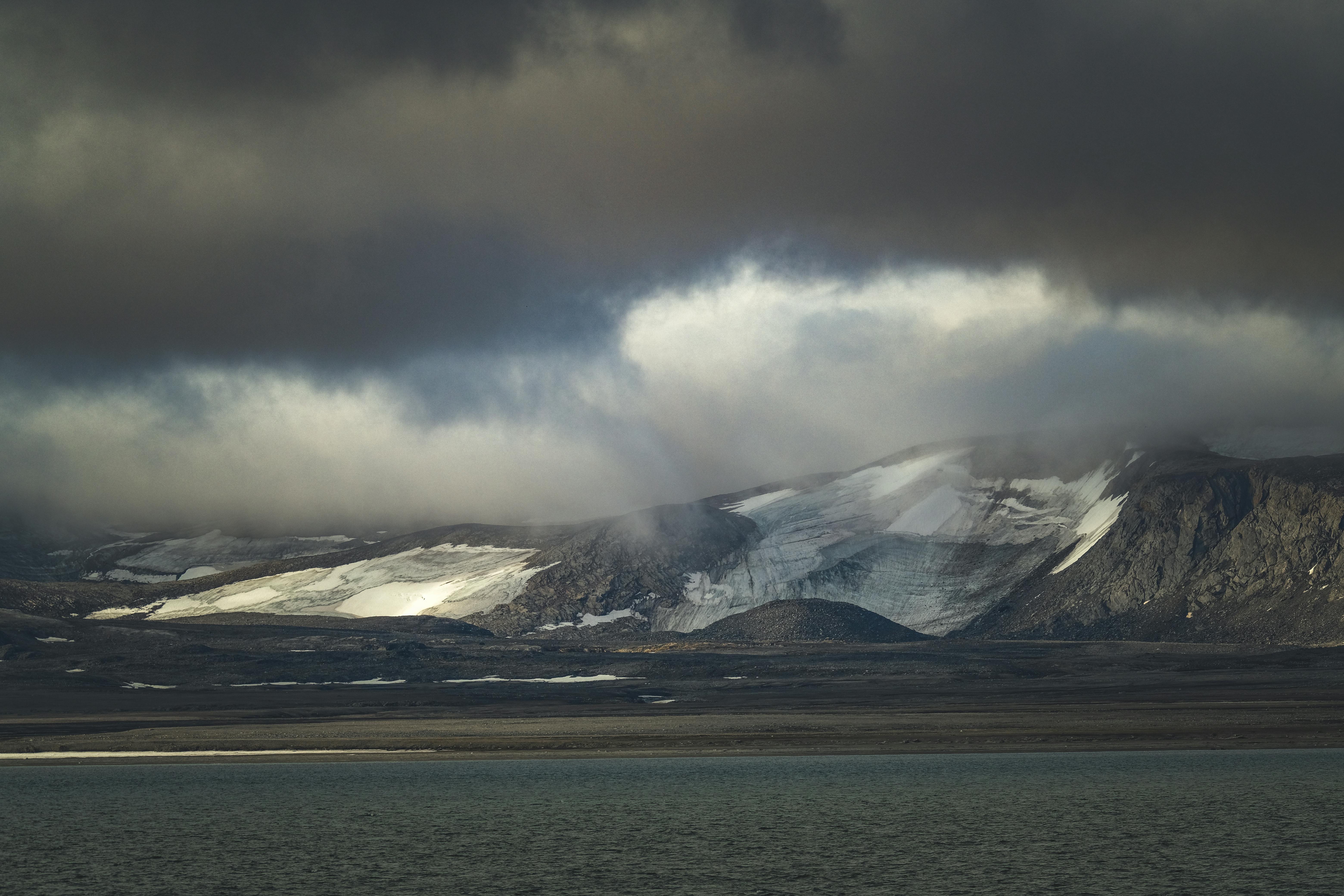 Storm Cloud over Barren Sea Shore in Winter · Free Stock Photo
