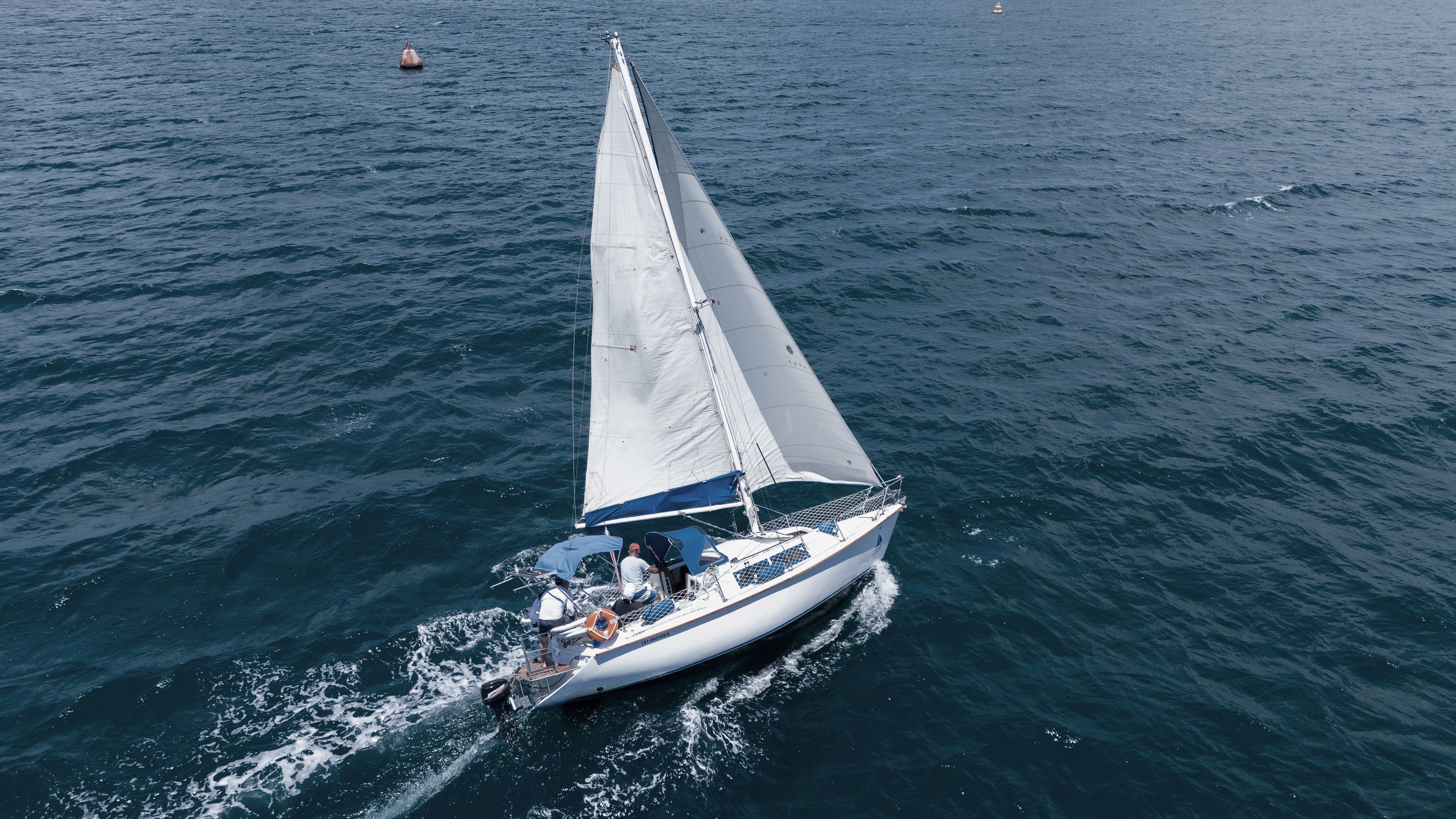 People Sailing on Sailboat on Sea · Free Stock Photo