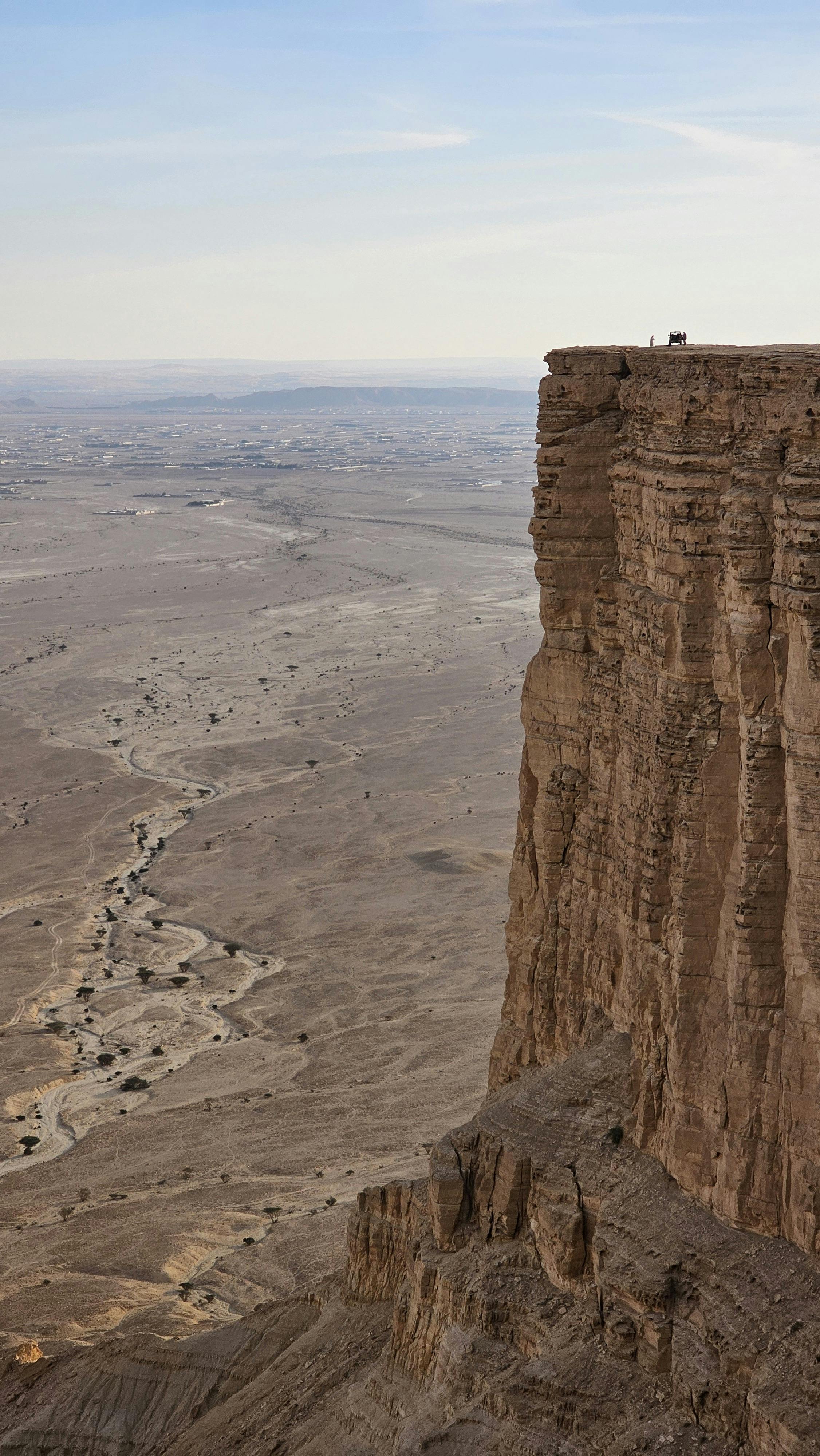 High majestic rough hill surrounded with green glades · Free Stock Photo
