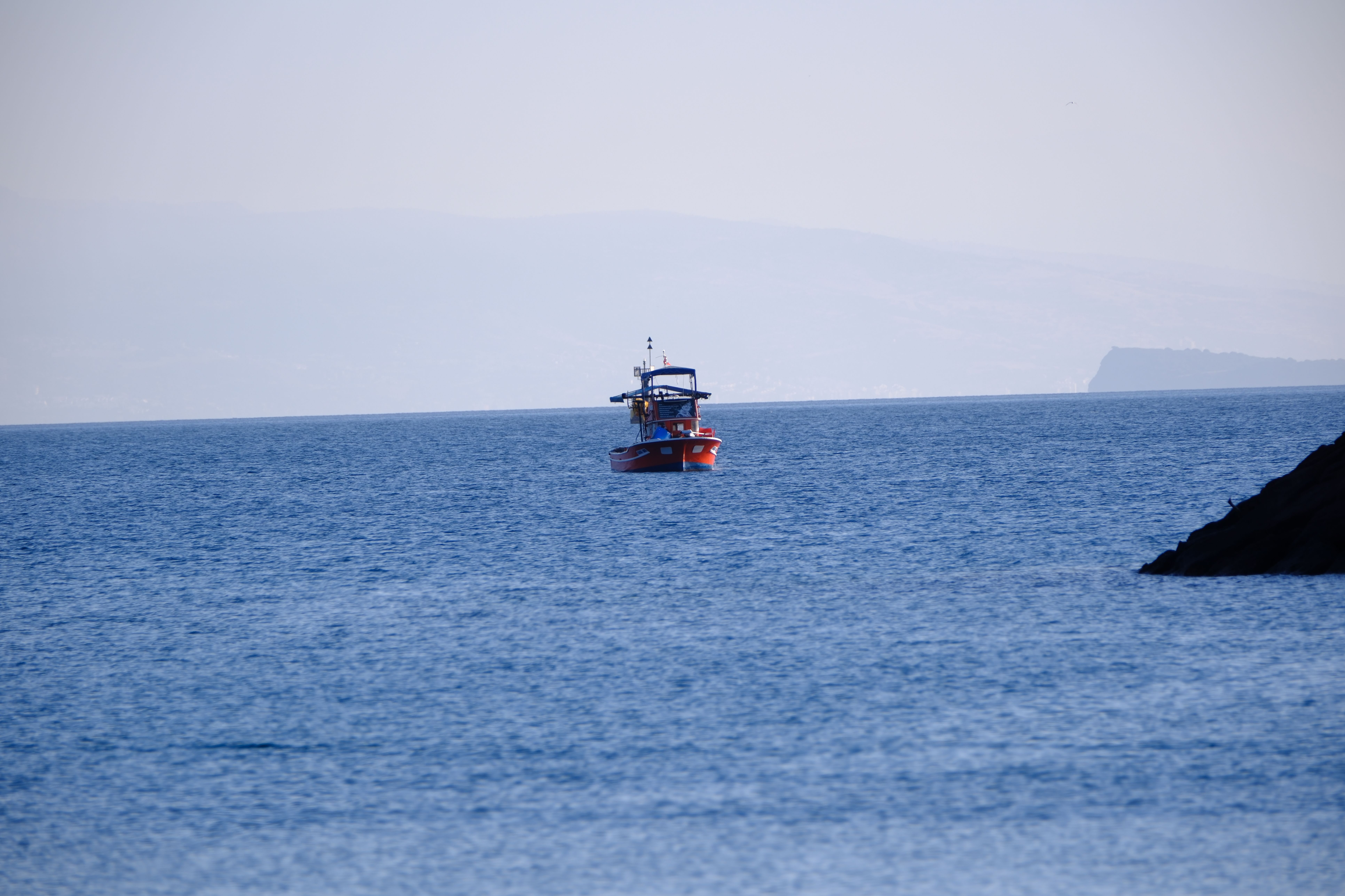 Motorboat Boating on Sea Coast · Free Stock Photo