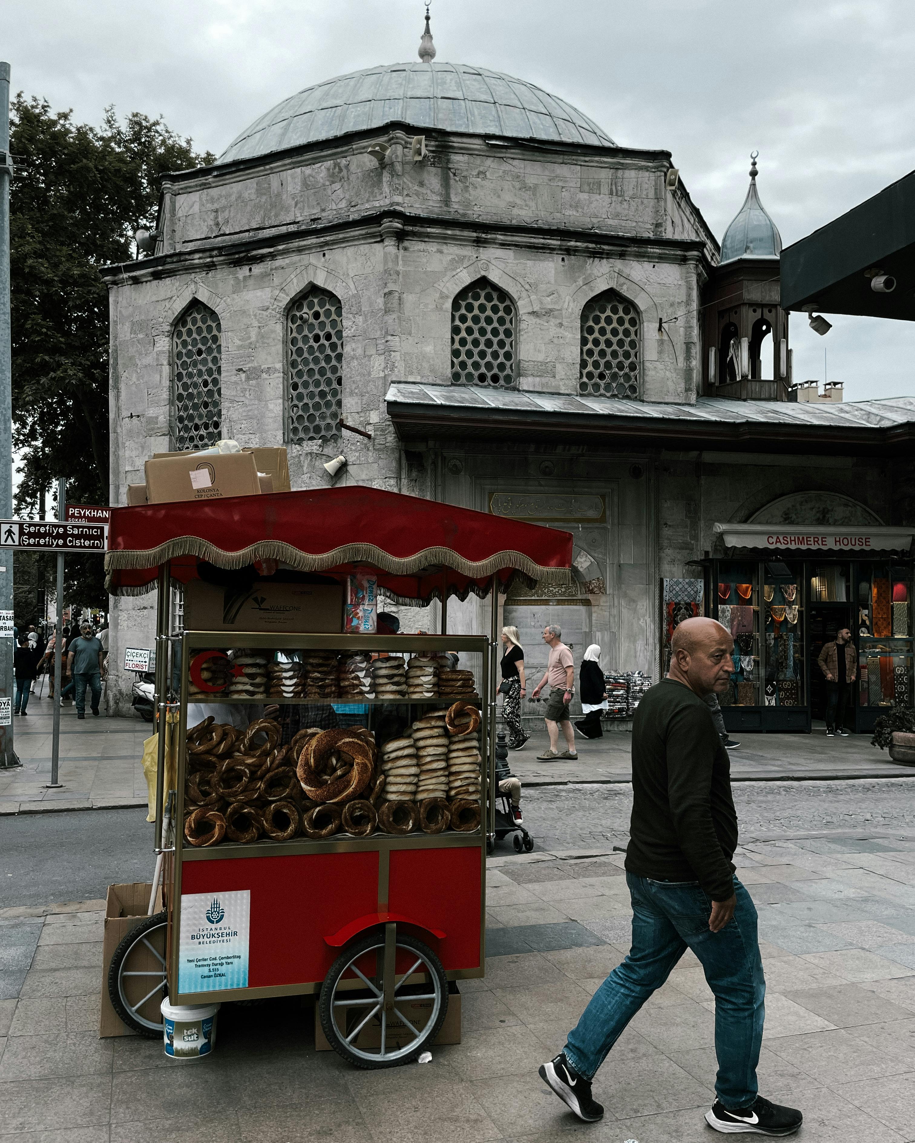 A Food Cart with Simit Bread Standing on the Sidewalk on the Background ...