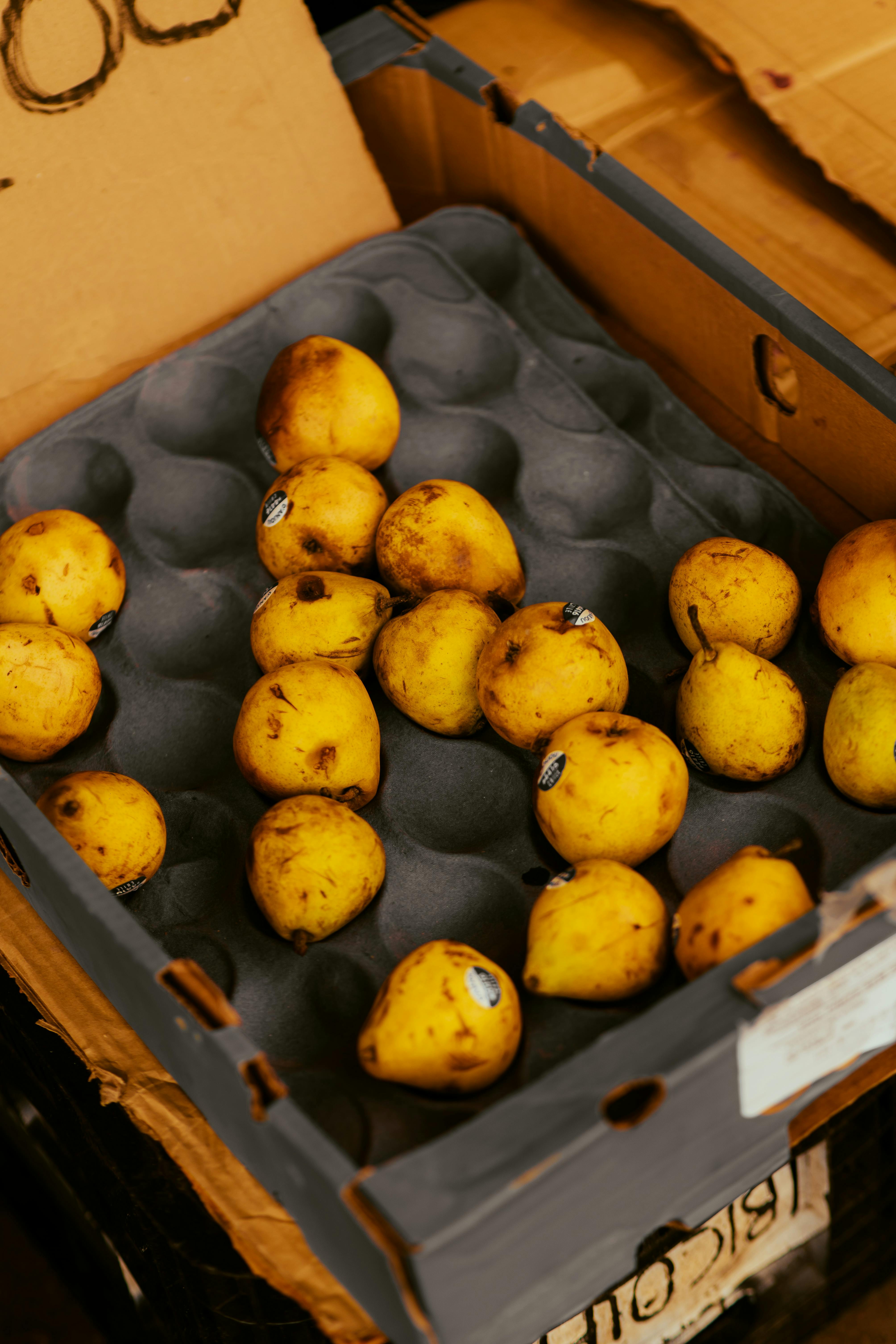 Close-up of a Box of Pears at the Market · Free Stock Photo