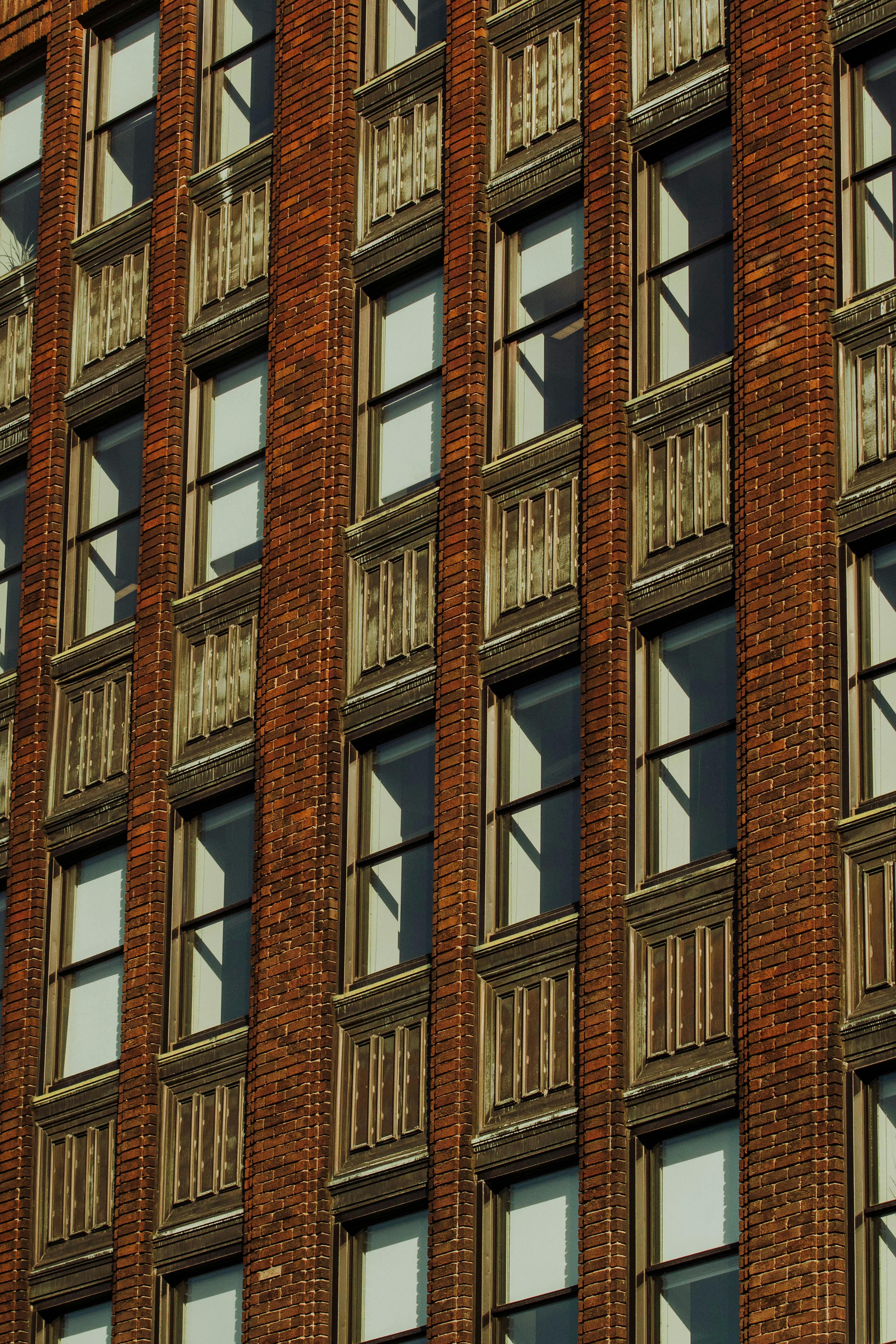 Brick Building with Rows of Windows · Free Stock Photo