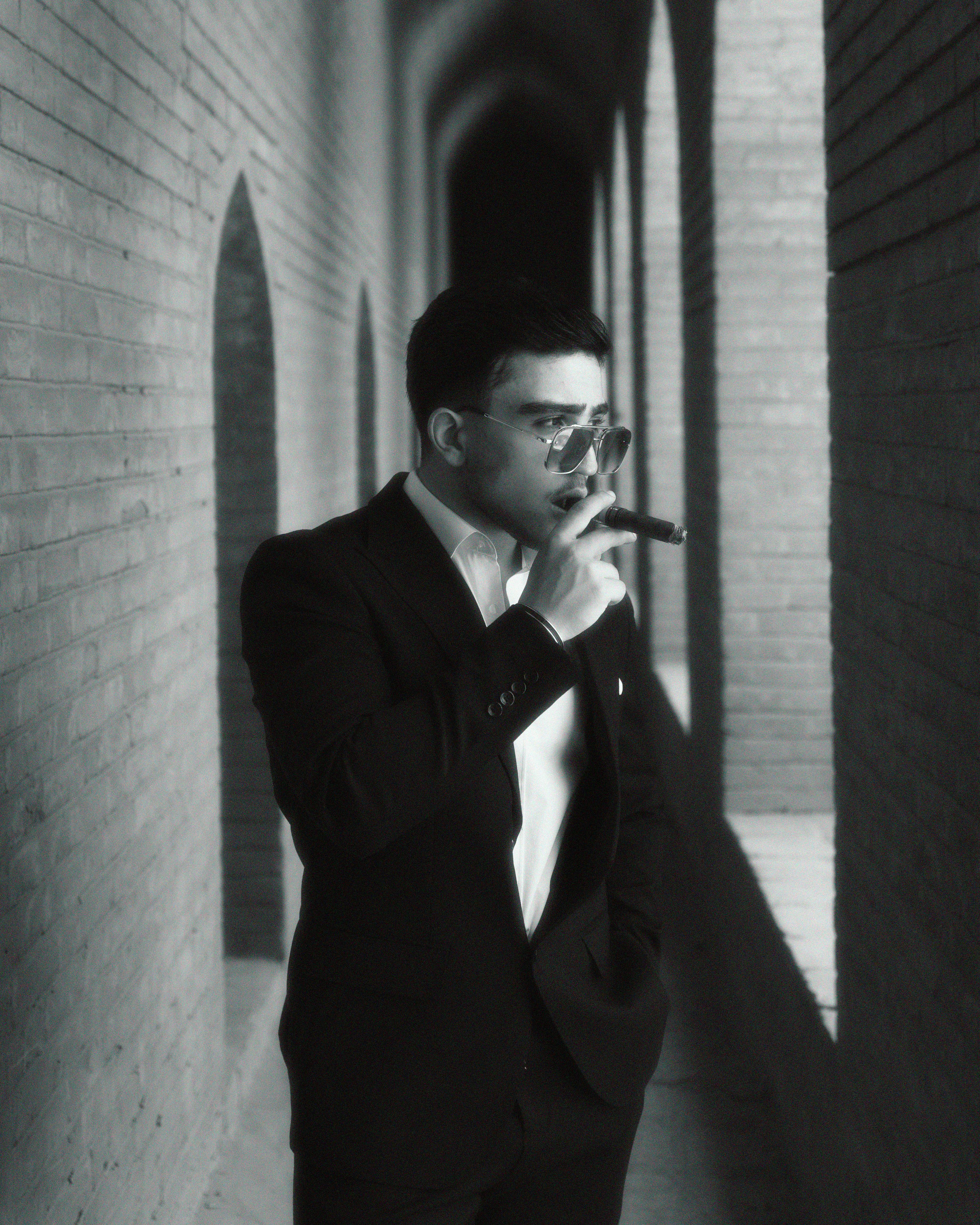 Model in Tuxedo Smoking a Cigar · Free Stock Photo