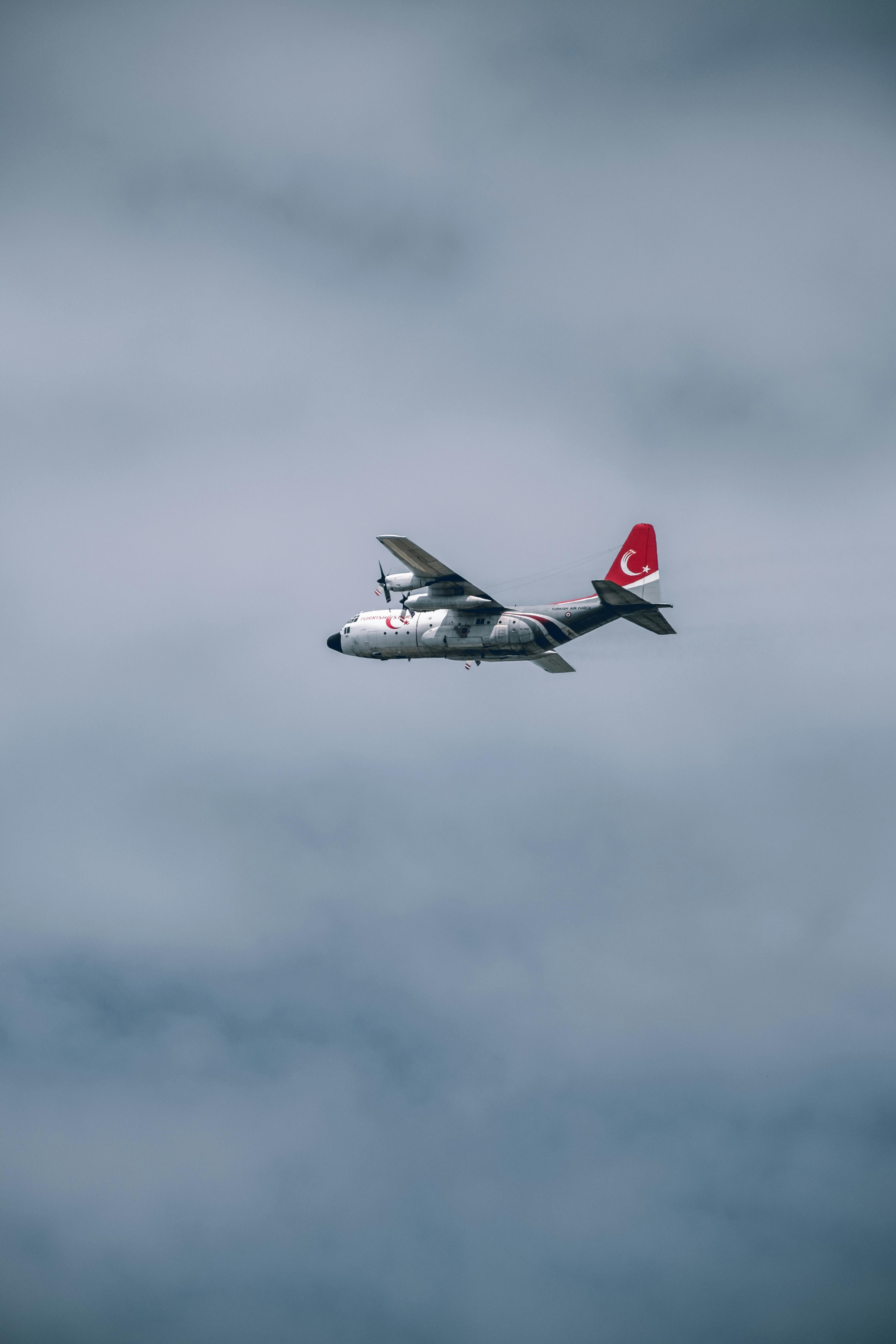 A small airplane flying in the sky · Free Stock Photo