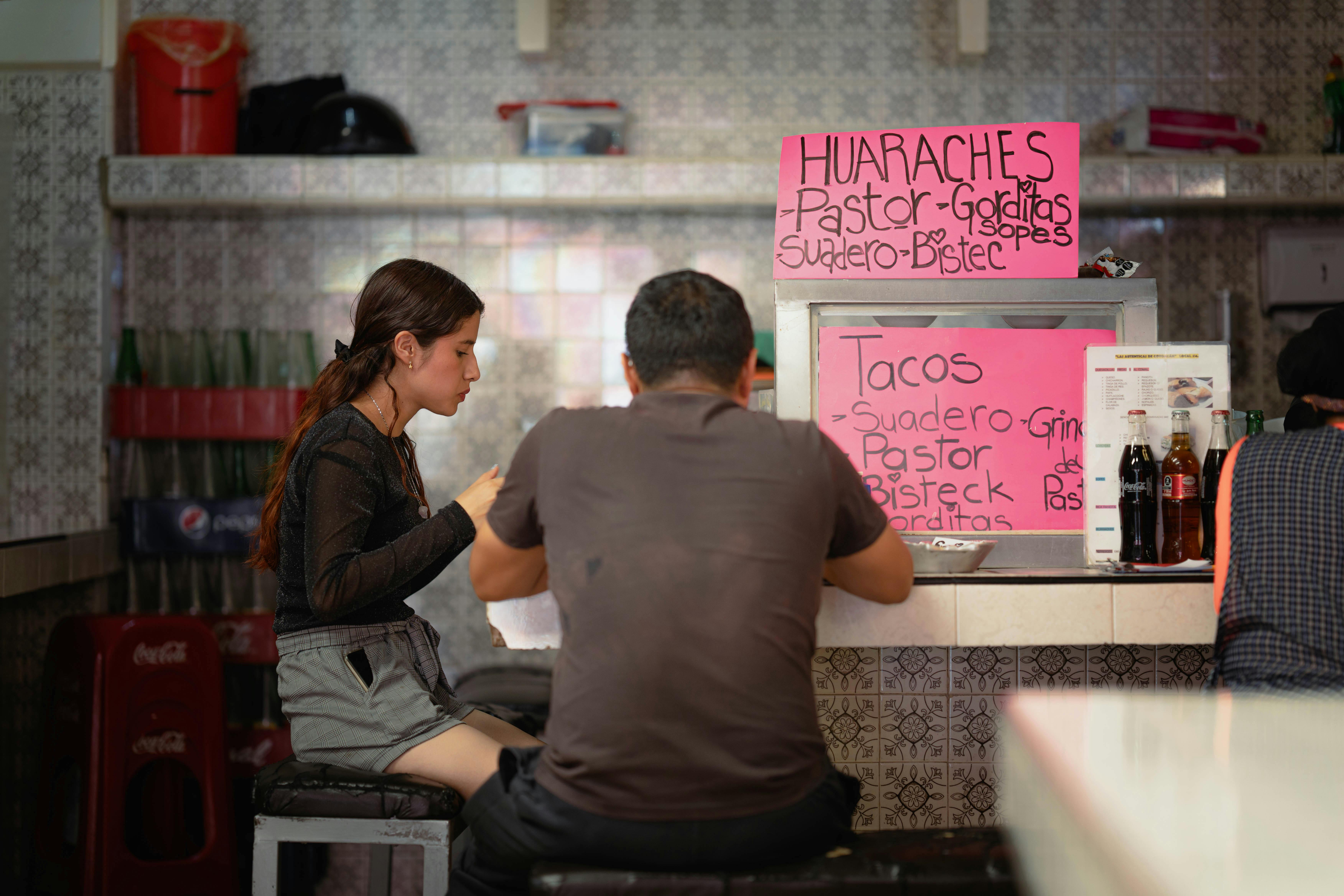 Two People Sitting at the Counter · Free Stock Photo