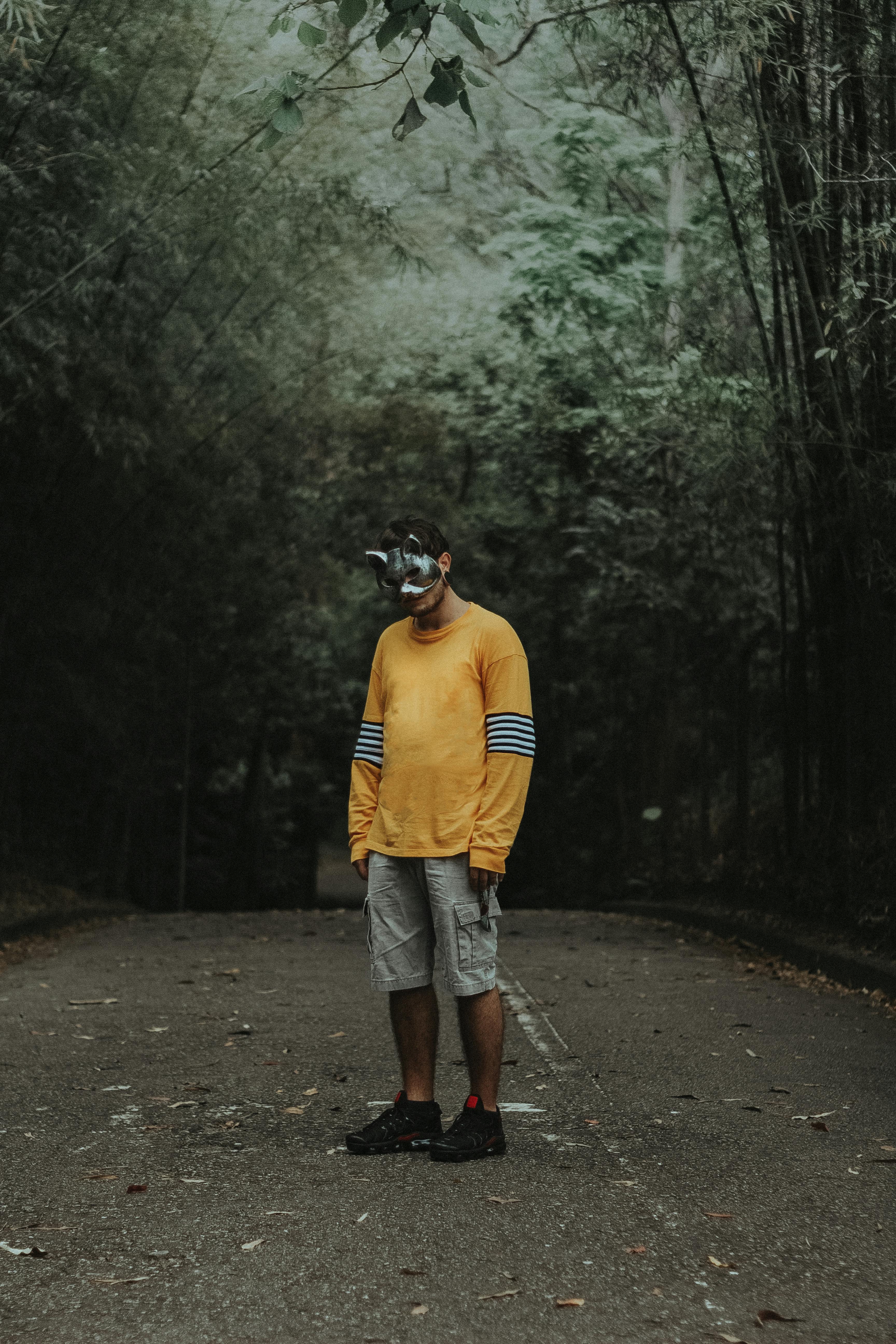 Photo of Man in Bunny Mask, Yellow Sweatshirt, and Cargo Shorts ...