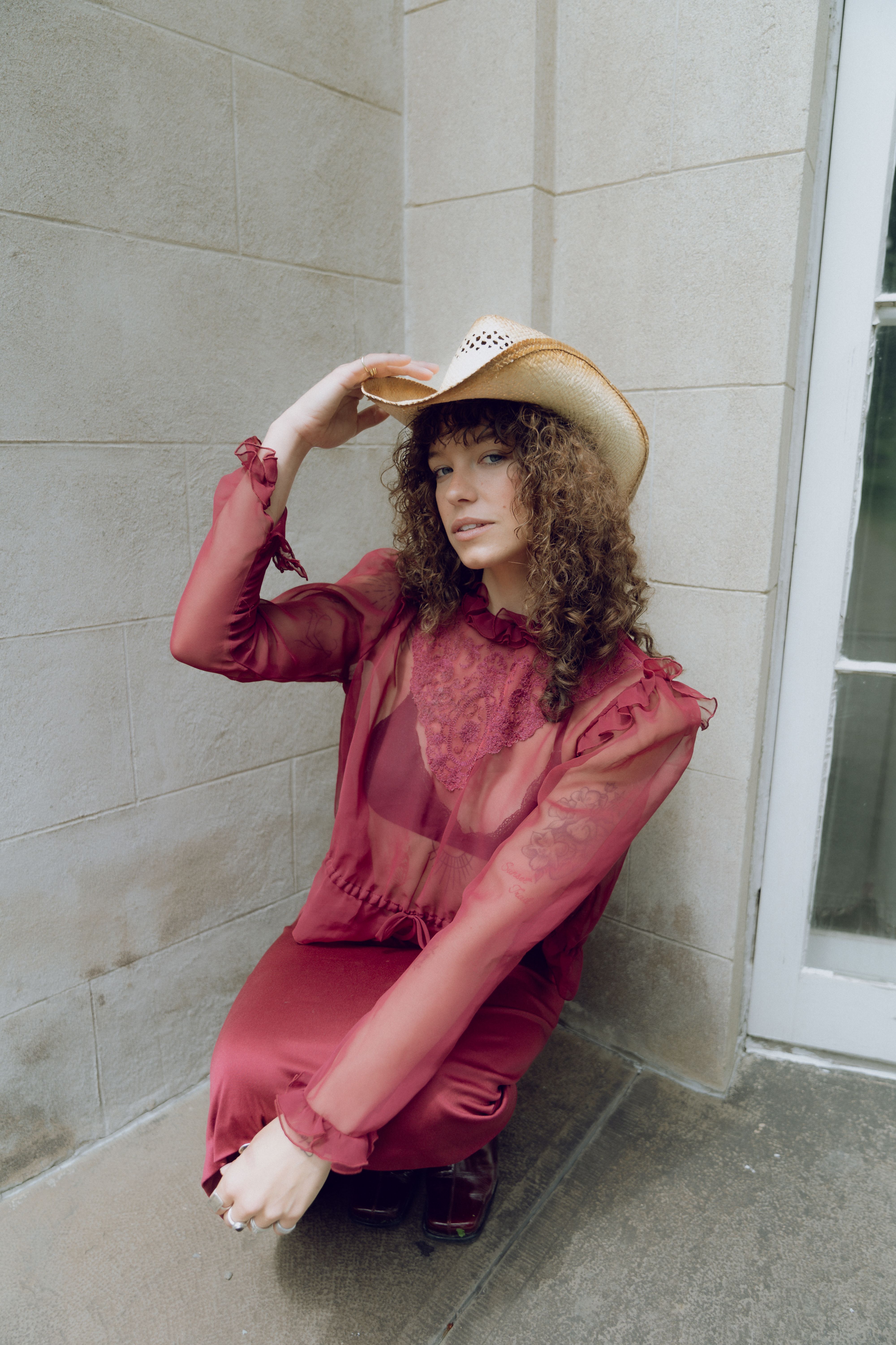 A woman in a red dress and cowboy hat · Free Stock Photo