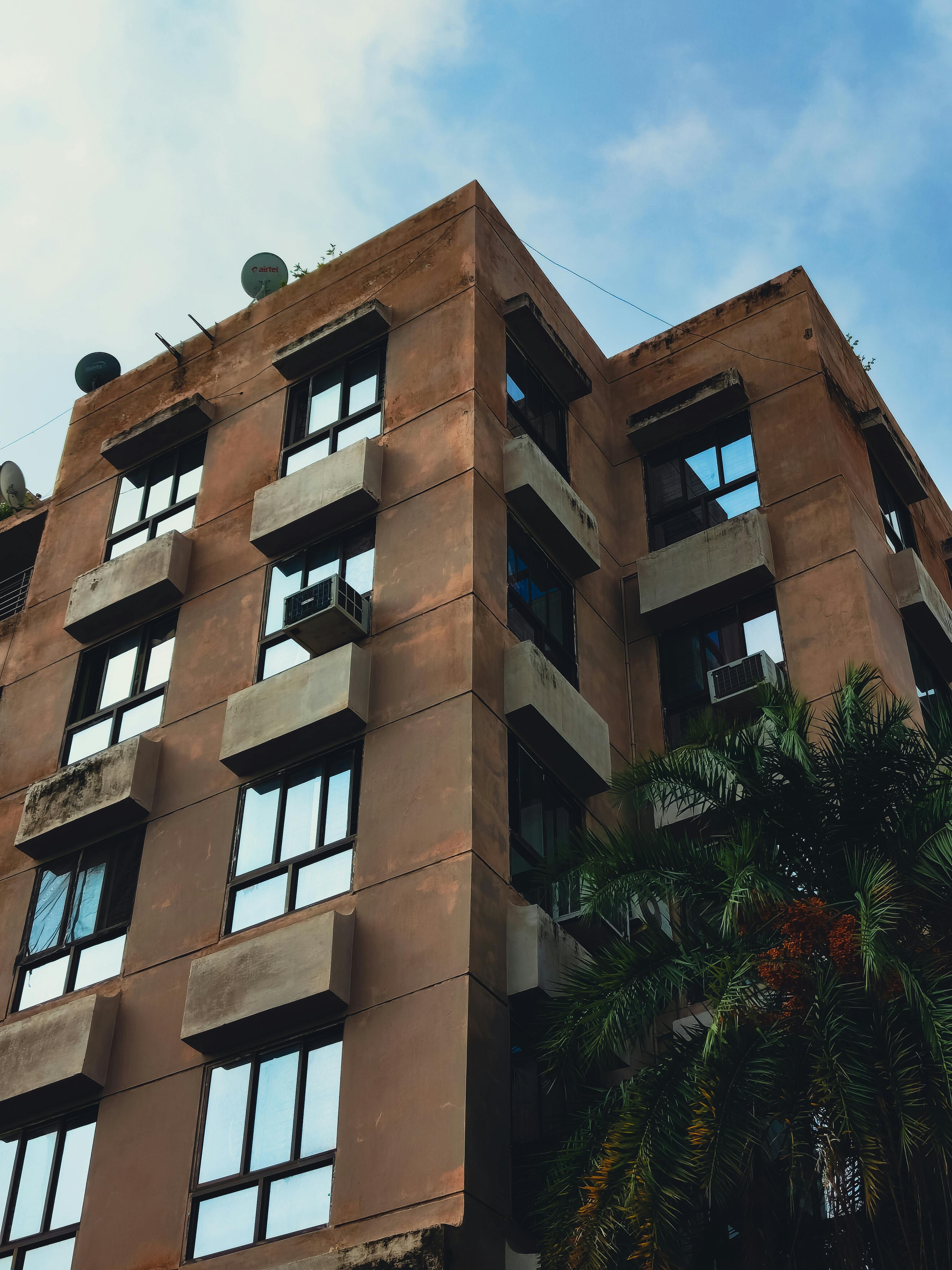Palm Trees and Exterior of a Modern Residential Block in City · Free ...