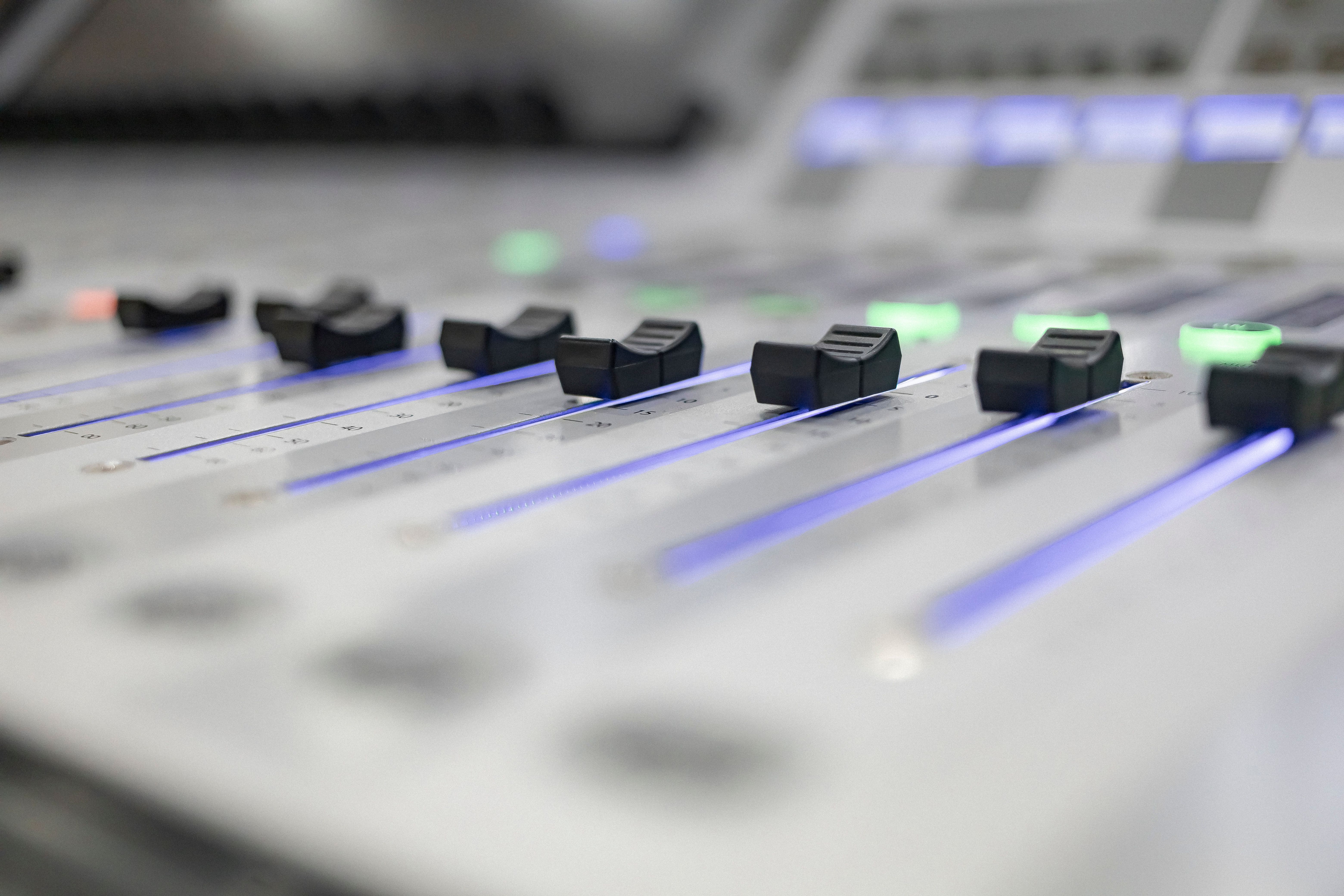 A close up of a sound mixer with blue lights · Free Stock Photo