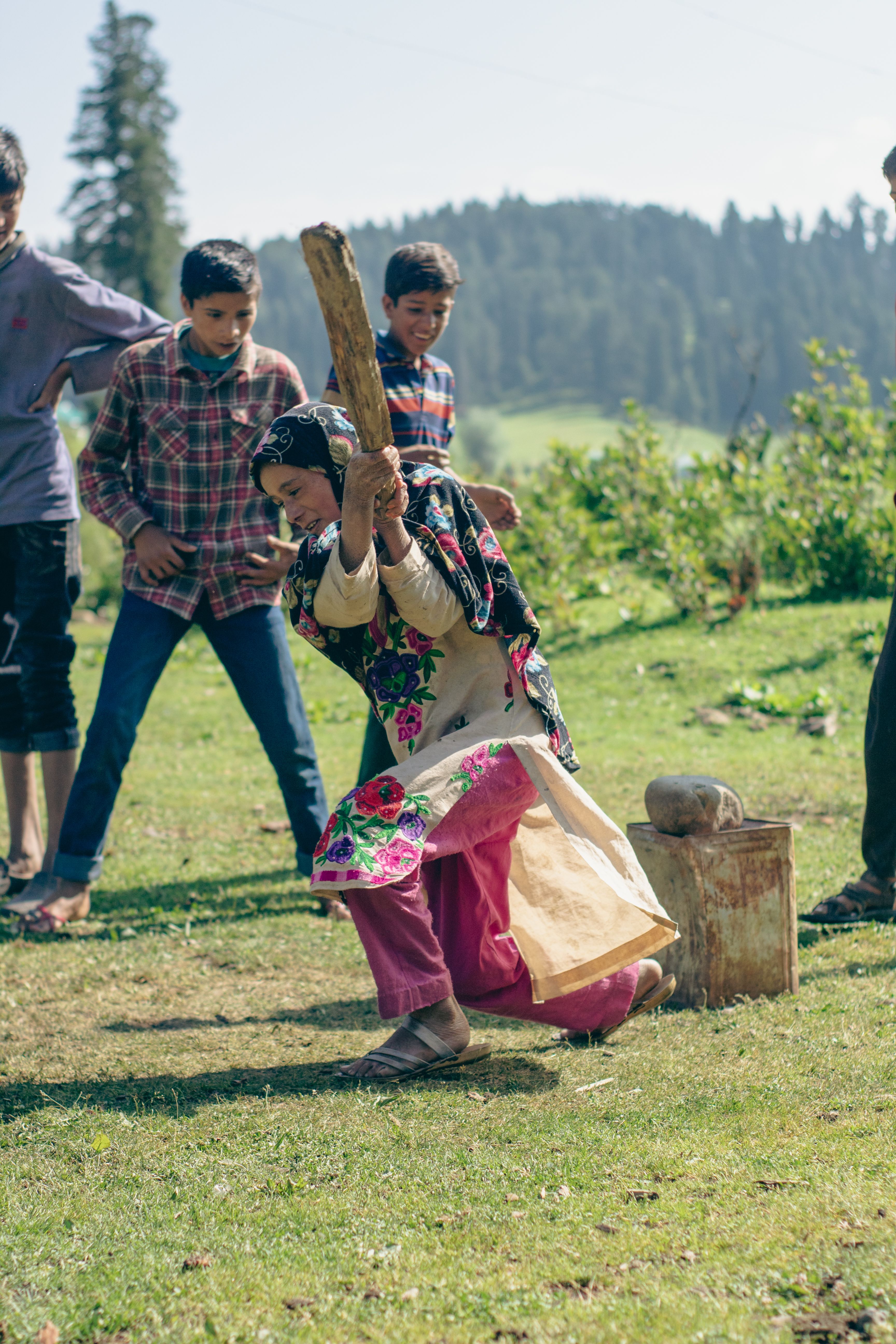 Girl in Traditional Clothing with Wooden Club in Traditional Ceremony ...