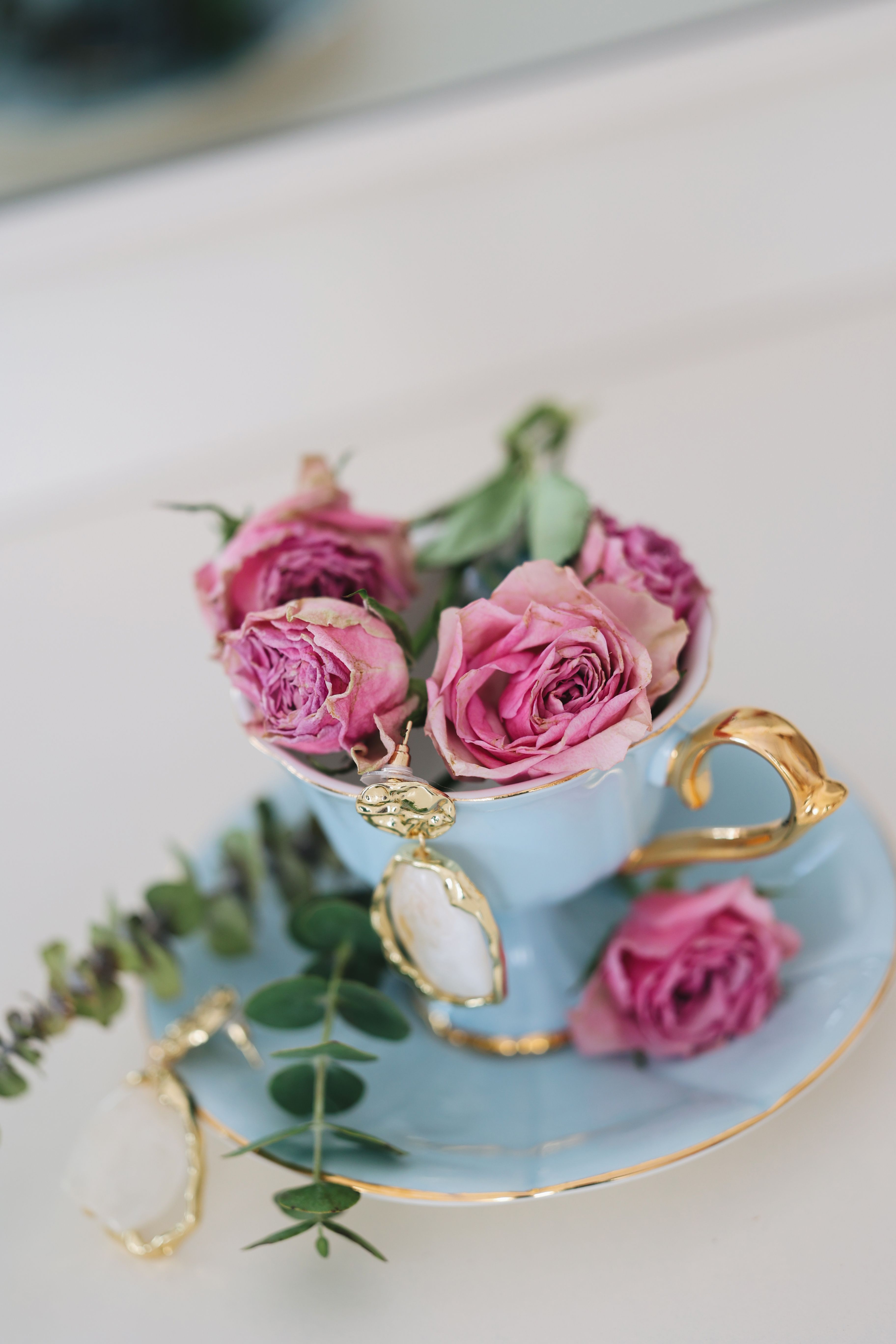 Close-up of Pink Roses Lying on a Blue Porcelain Cup · Free Stock Photo