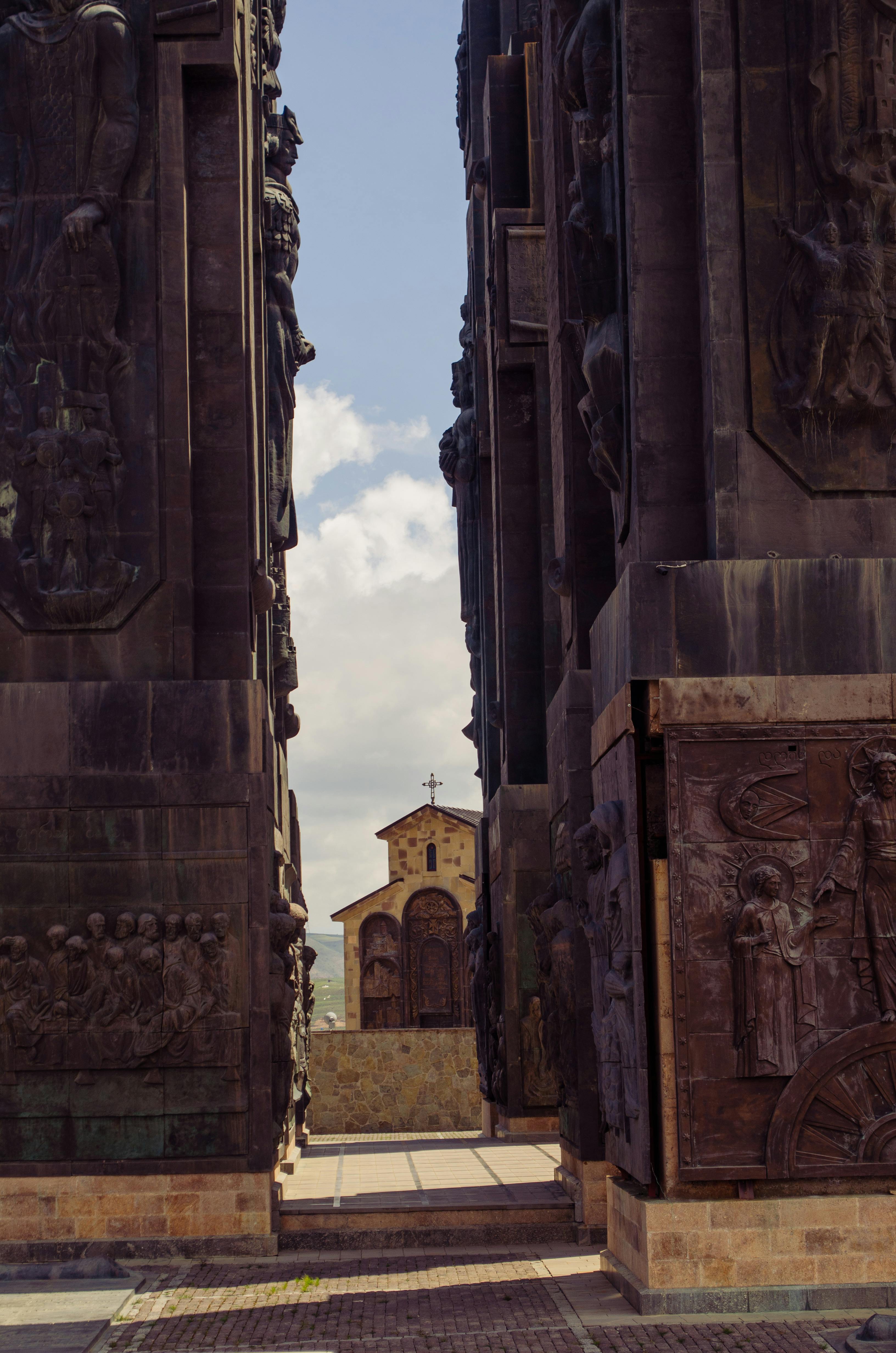 View of Small Chapel behind Chronicle of Georgia Monument Columns in ...