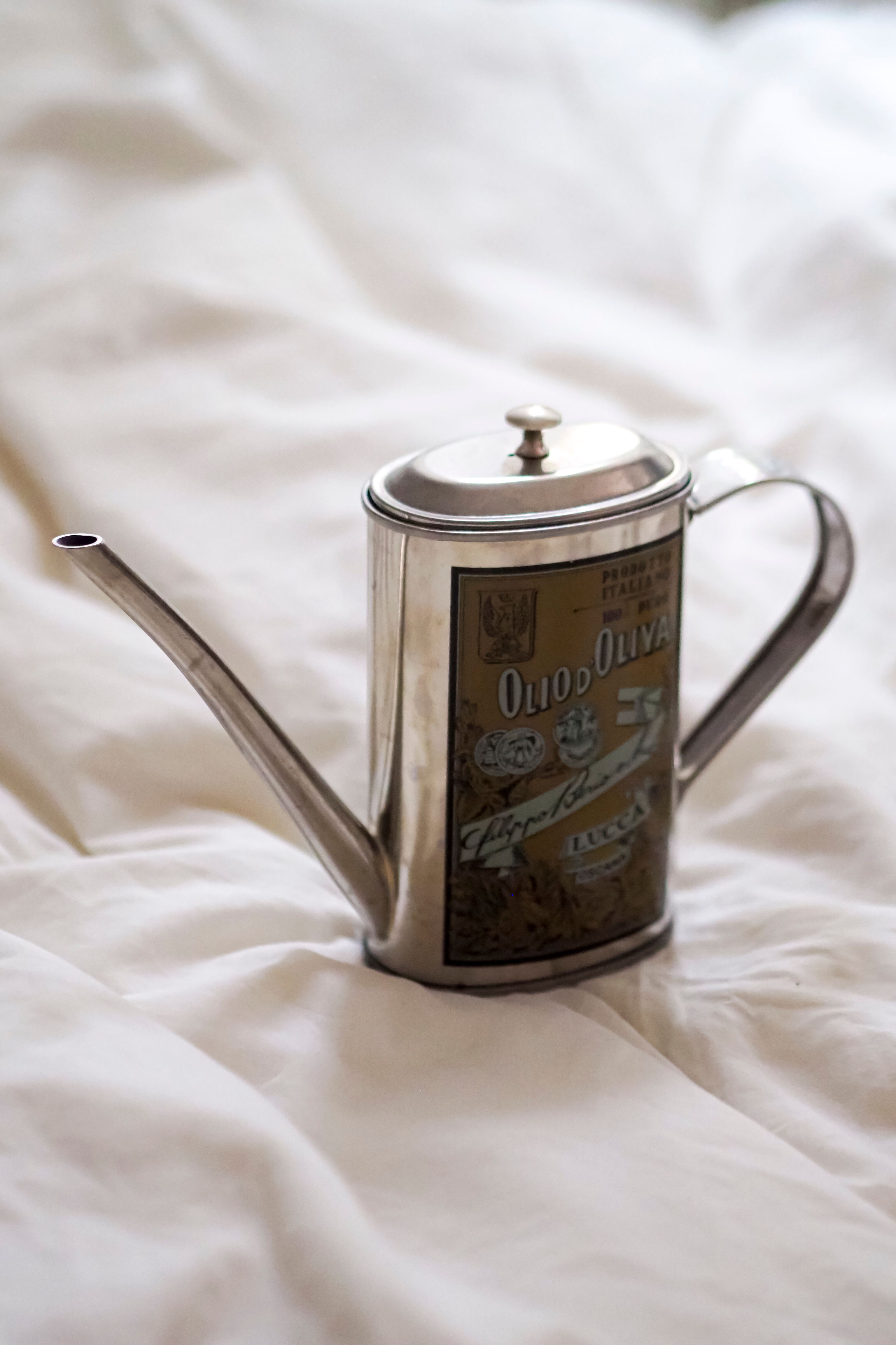 Metallic Kettle on White Sheet · Free Stock Photo