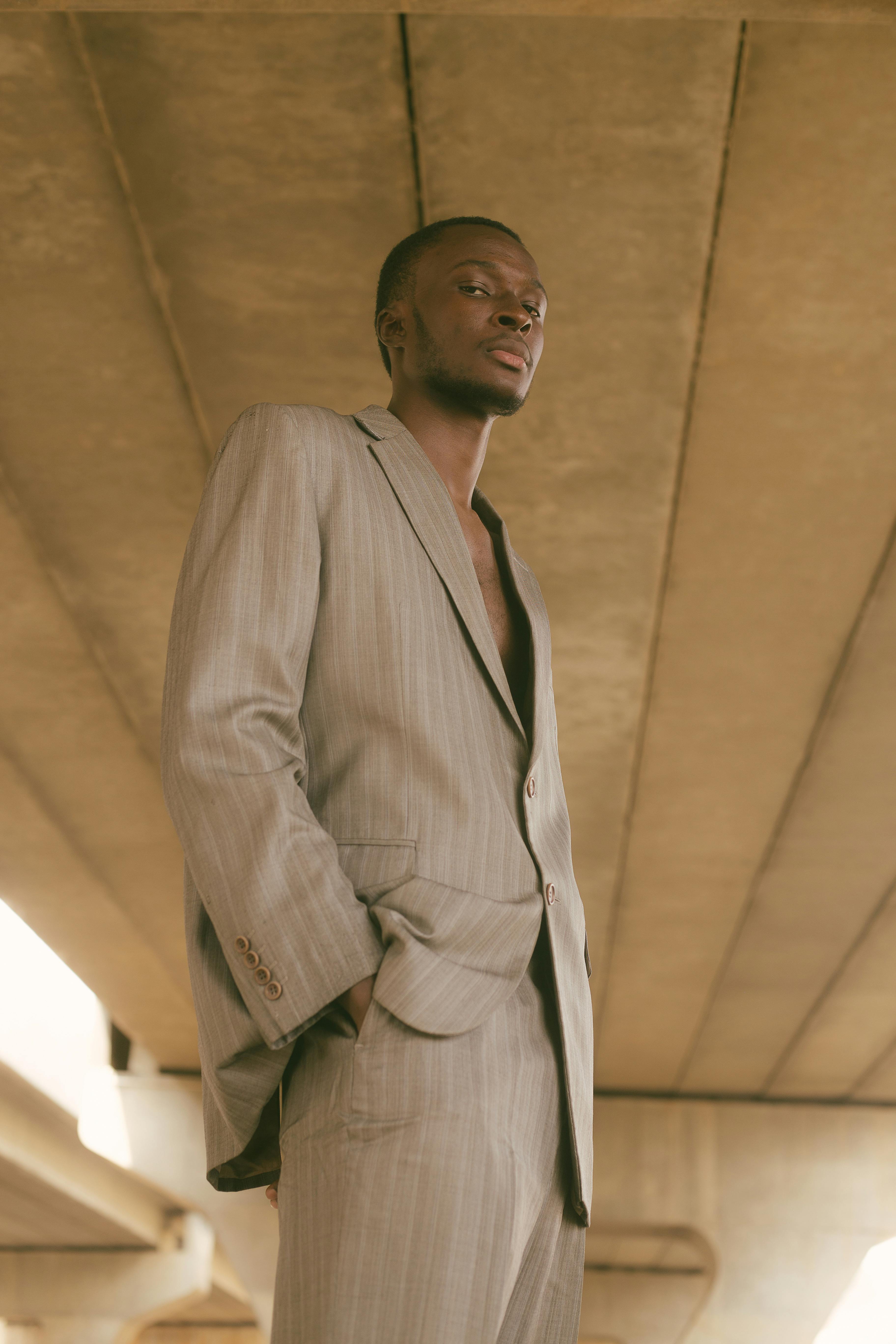 Man Posing in a Suit under a Bridge · Free Stock Photo