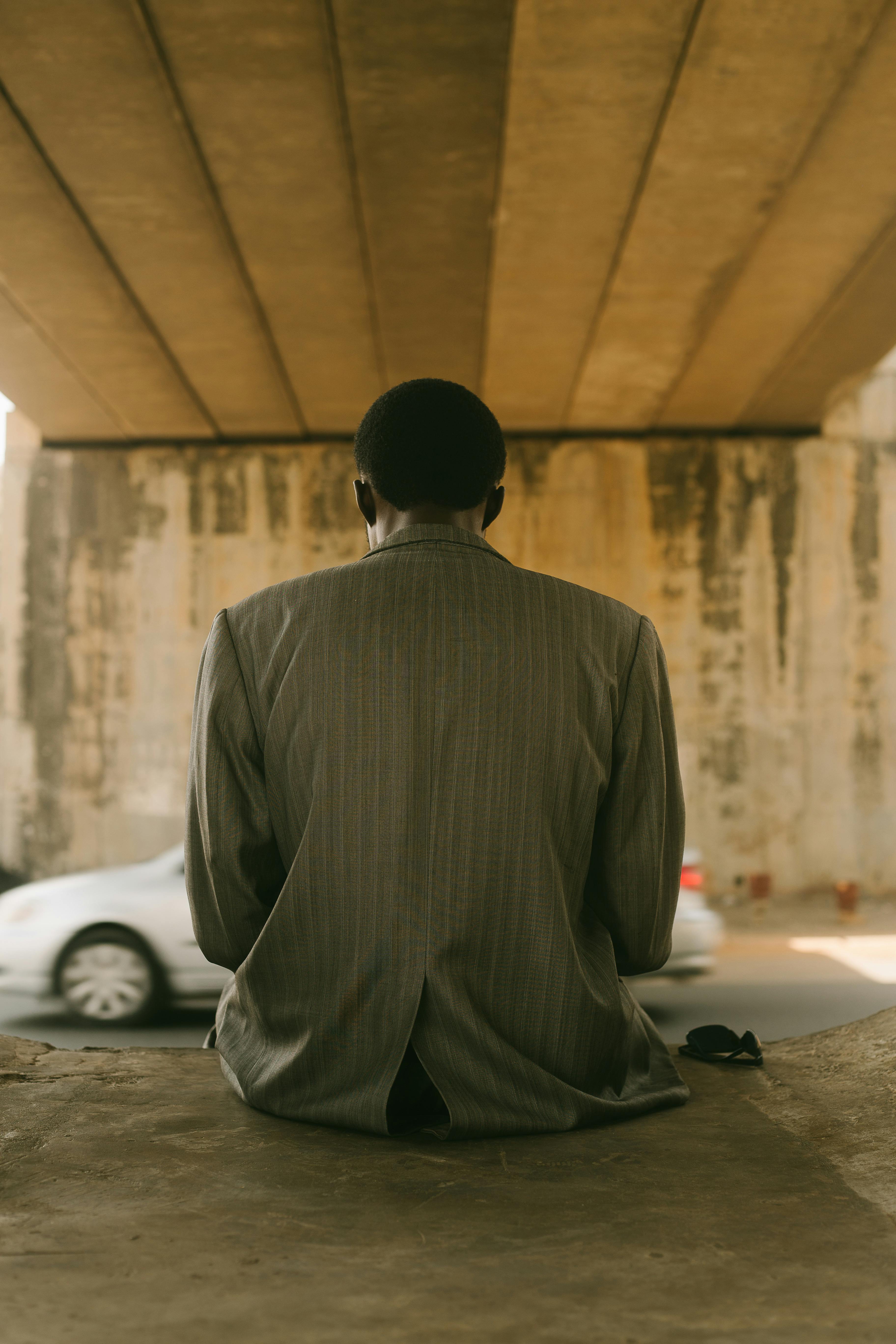 Back View of a Man in a Suit under a Bridge · Free Stock Photo
