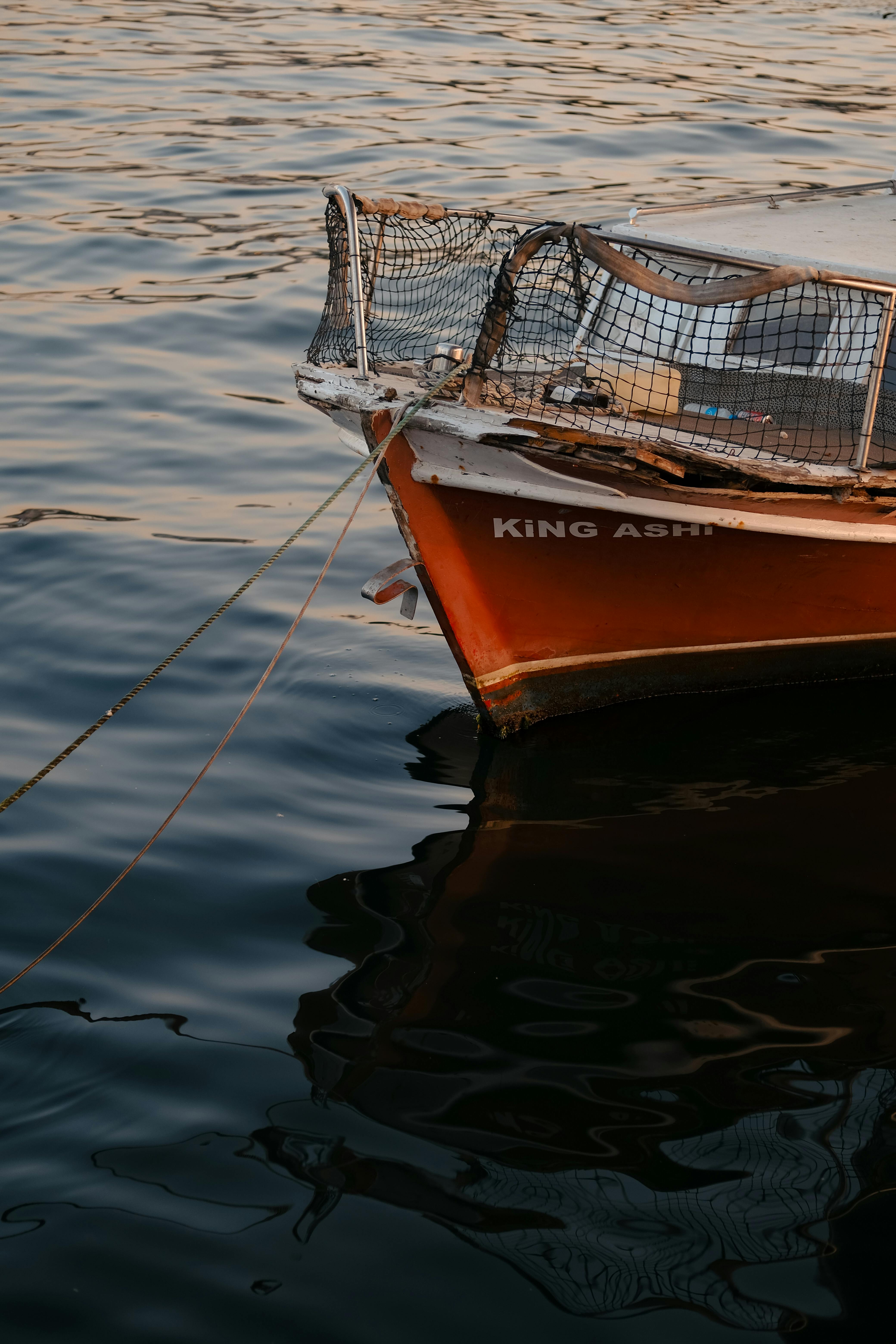 Vibrant Red Motorboat on Calm Lake Waters · Free Stock Photo