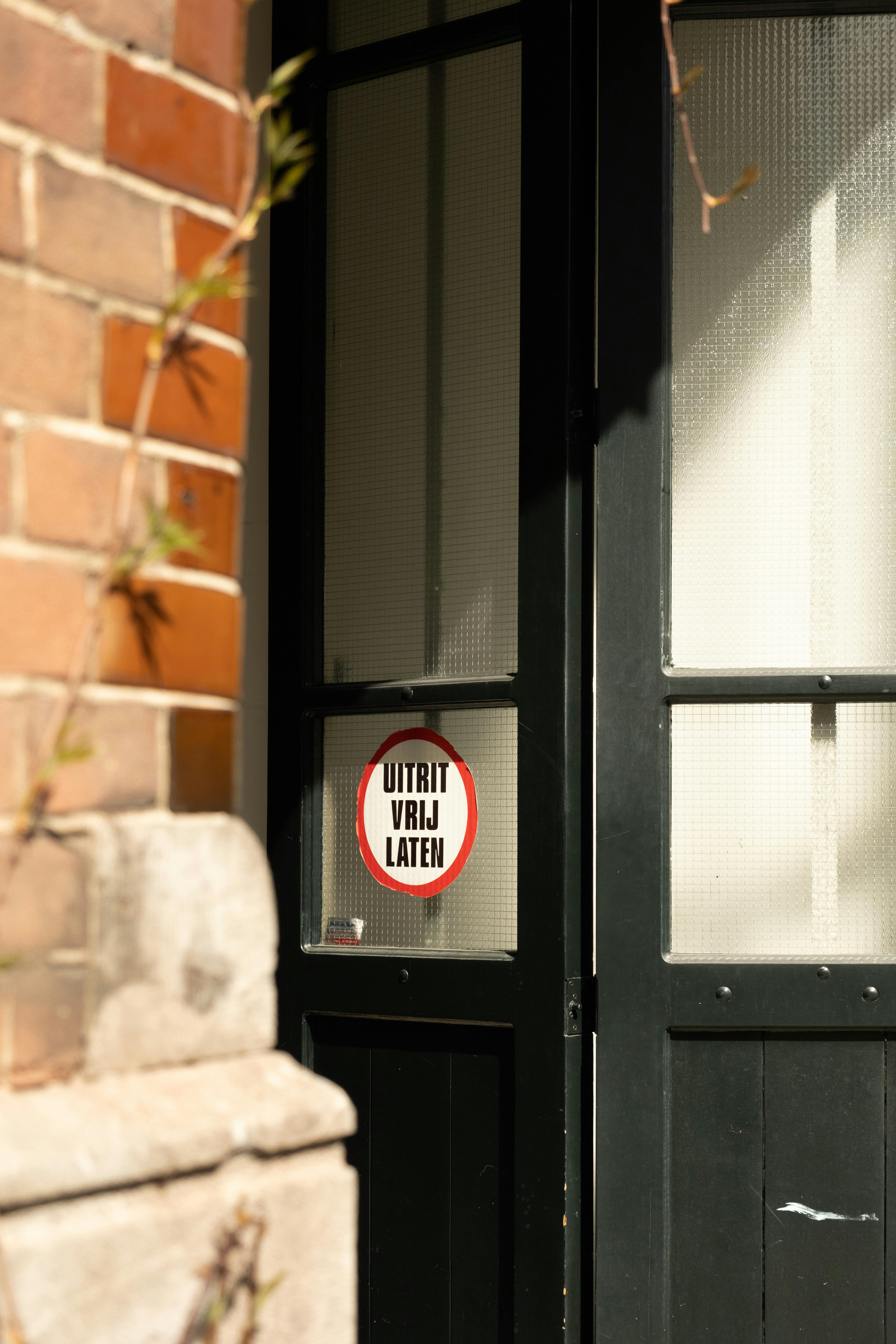 Warning Sign on Door Windows · Free Stock Photo