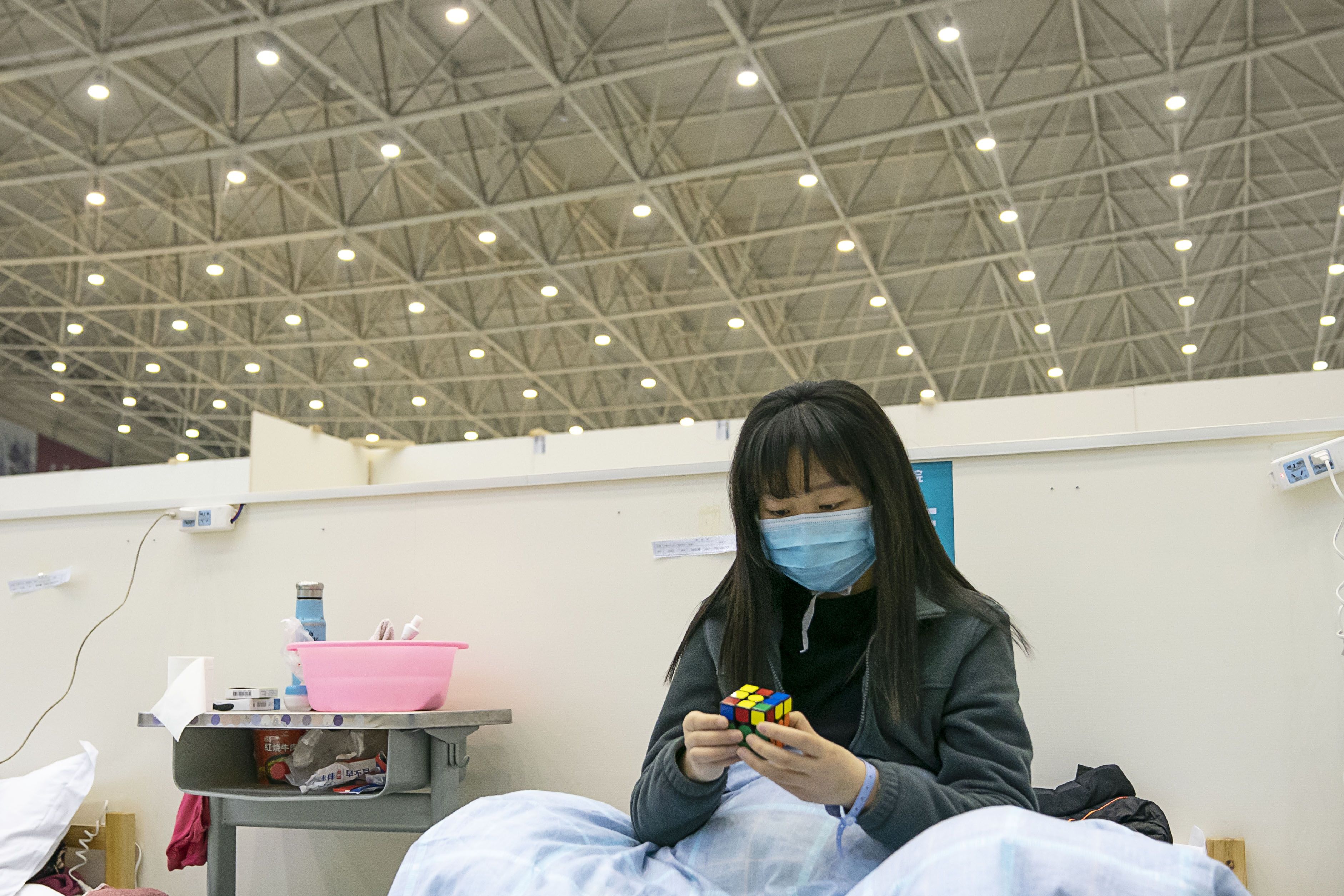 Woman Sitting and Playing with Rubik Cube in Hospital · Free Stock Photo