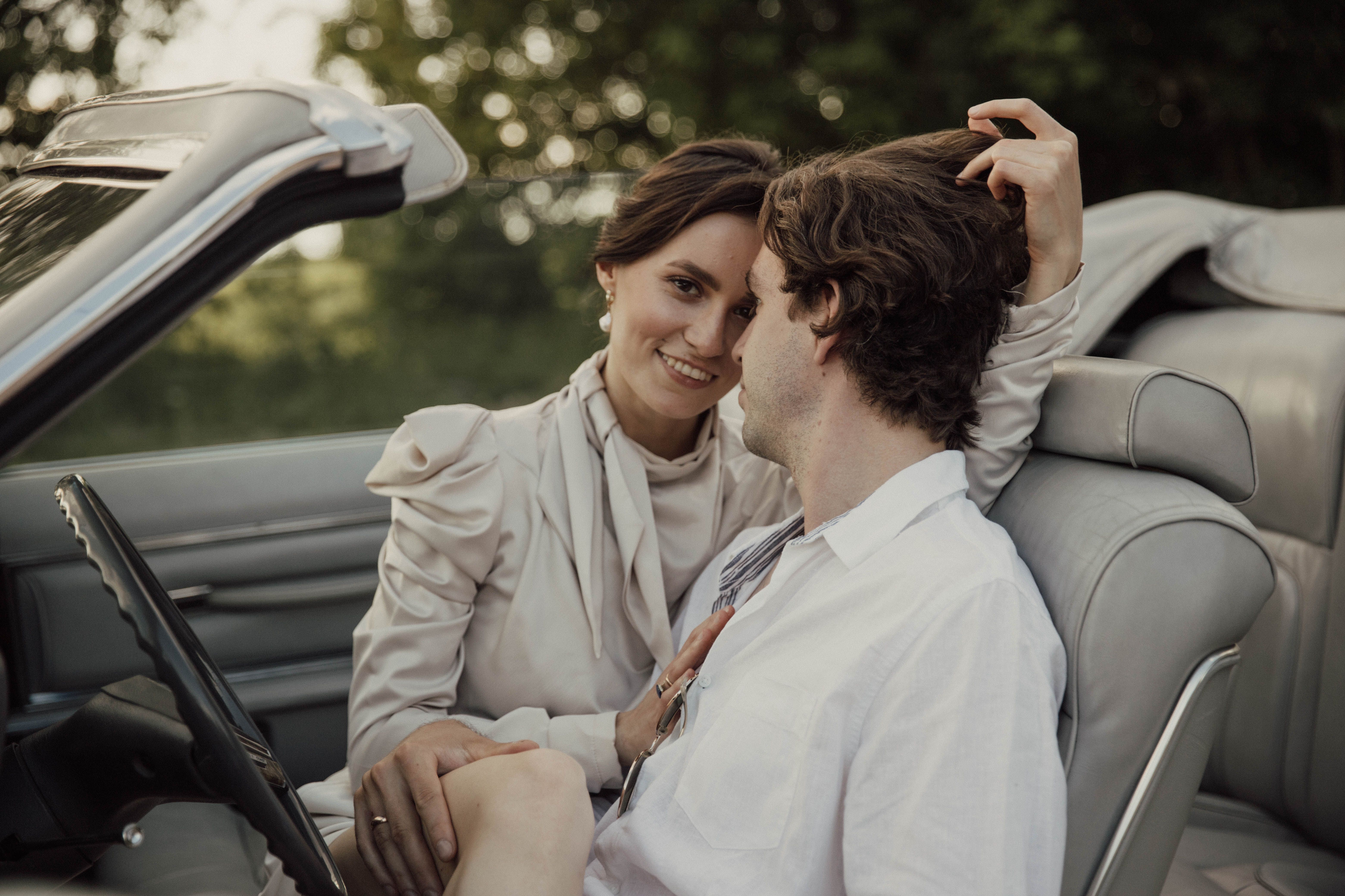 Smiling Couple Together in Convertible Car · Free Stock Photo