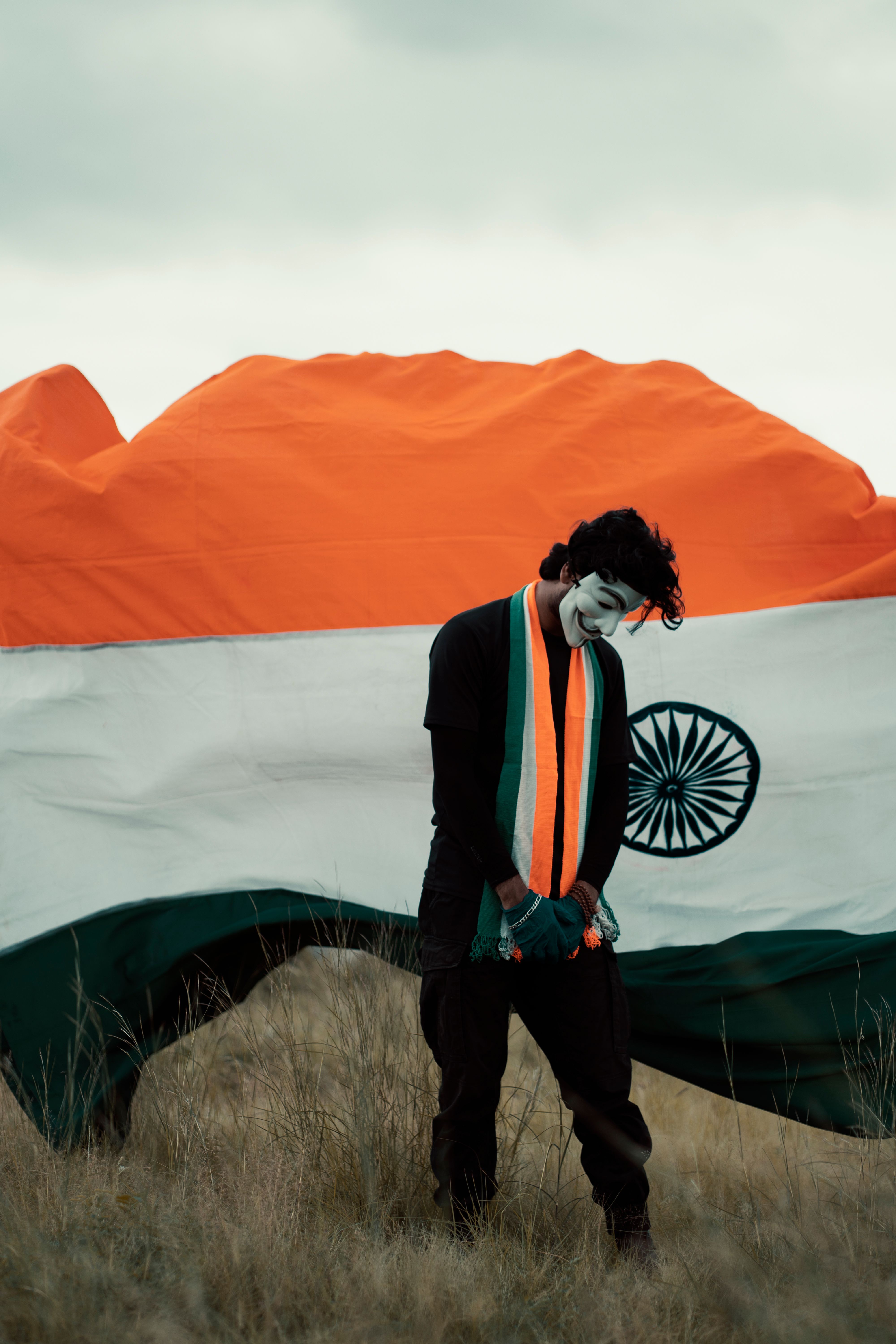 Man in Anonymous Mask Standing with Flag of India · Free Stock Photo