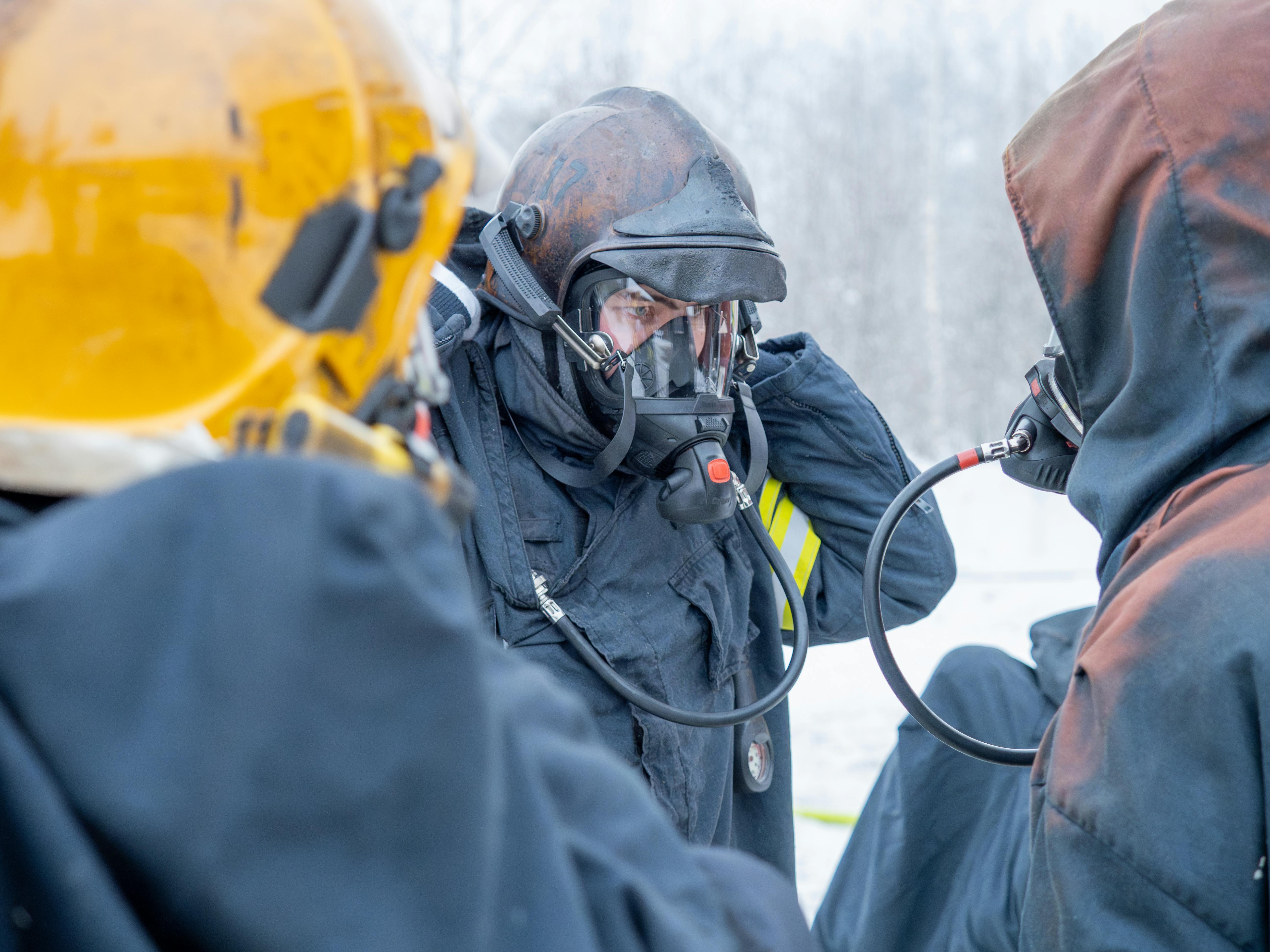 Men in Black Costumes with Gas Masks · Free Stock Photo