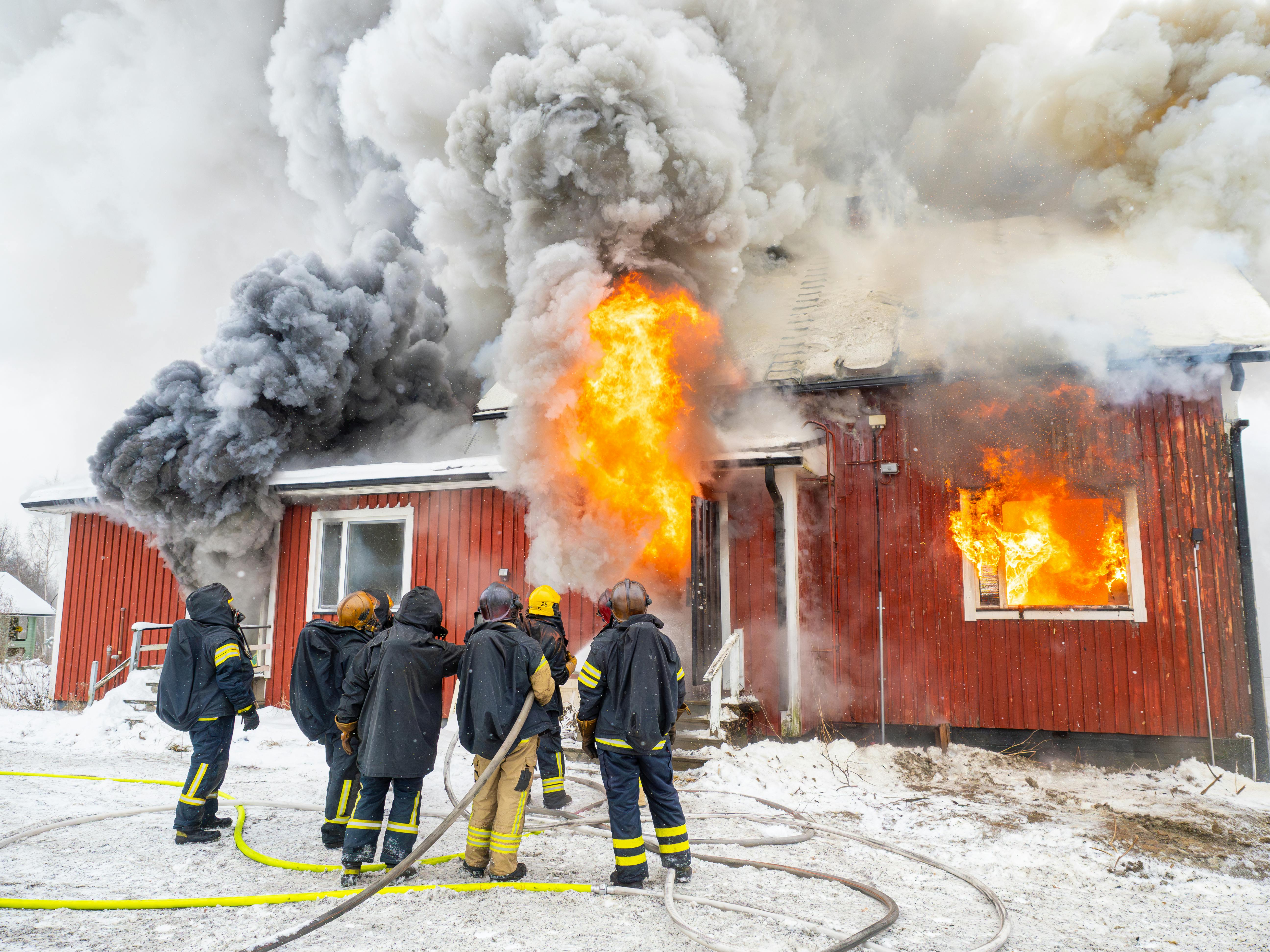 Firefighters Extinguishing a Fire · Free Stock Photo