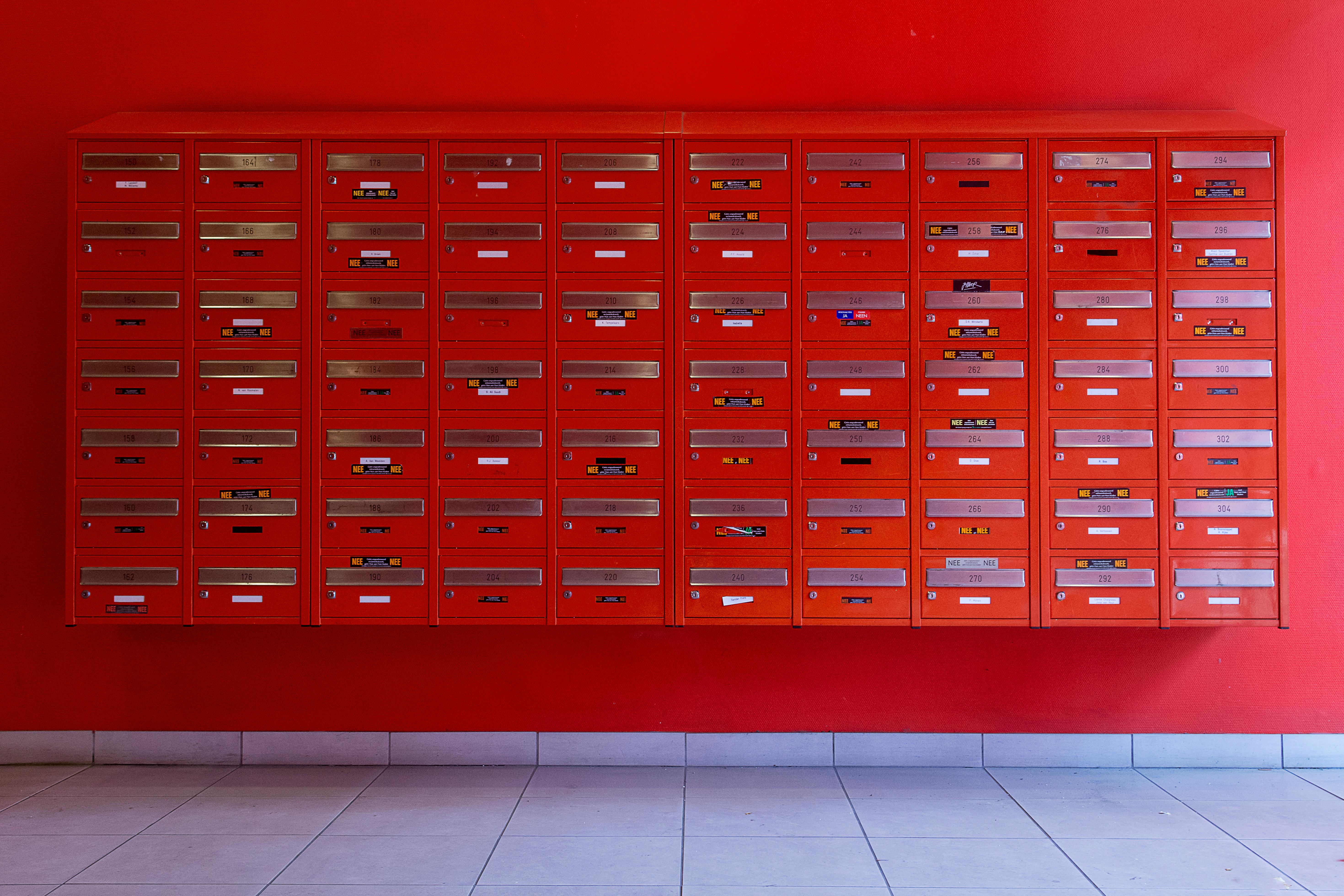 Red Letterboxes on a Red Wall · Free Stock Photo