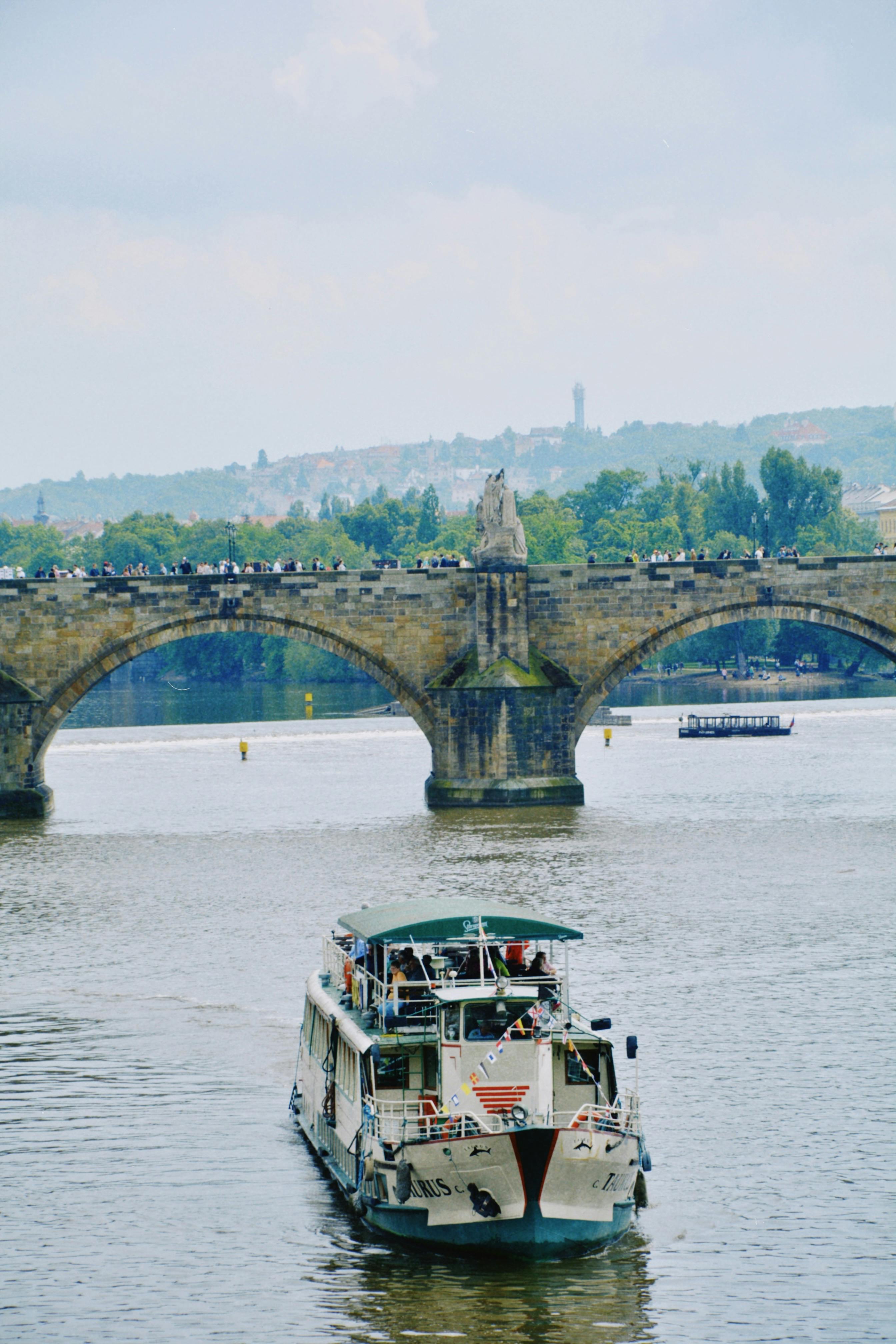 Ferry and Medieval Arch Bridge on the Vltava River in Prague · Free ...