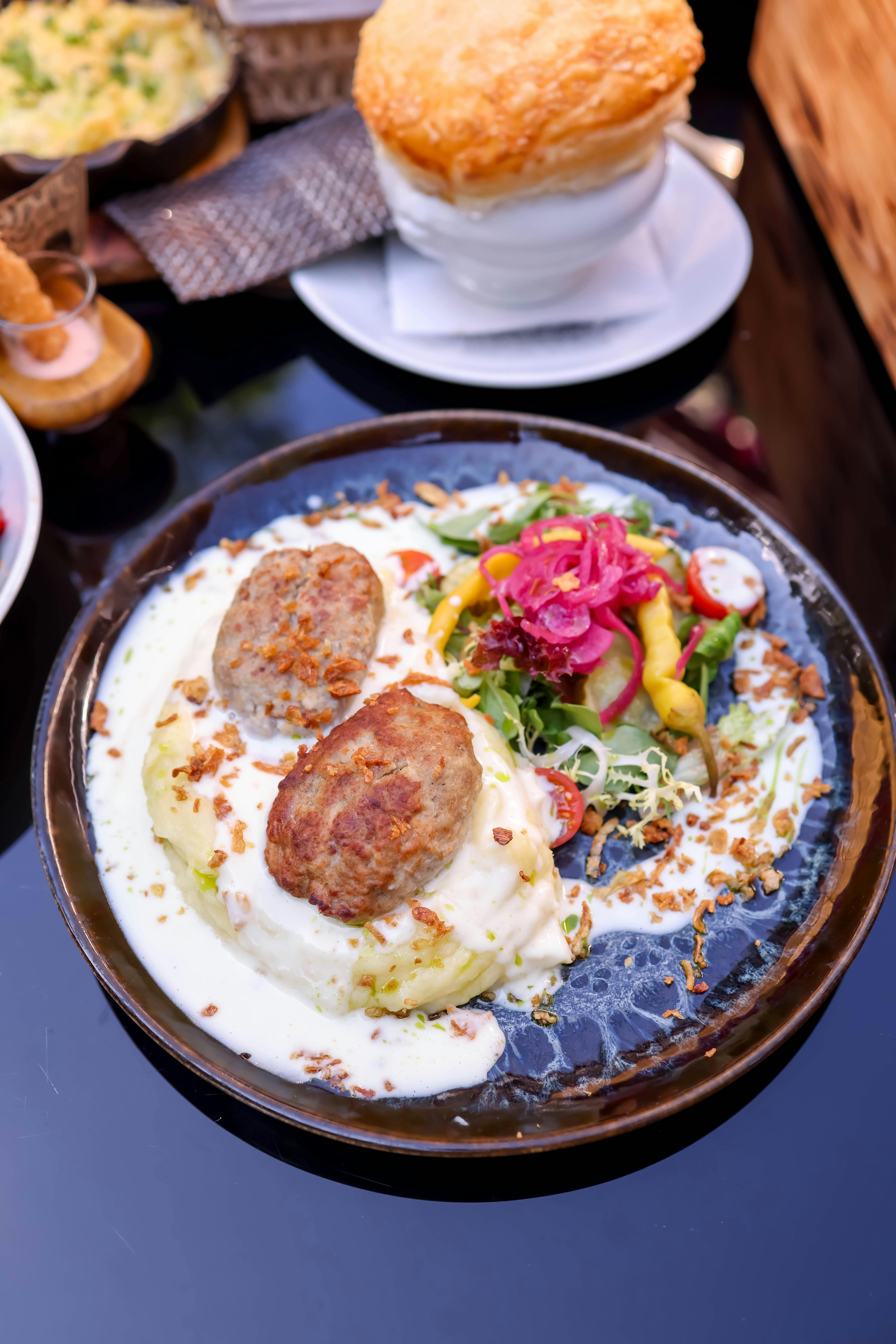 Mince Meat Cutlets on Mashed Potatoes Topped with Sour Cream and Salad ...