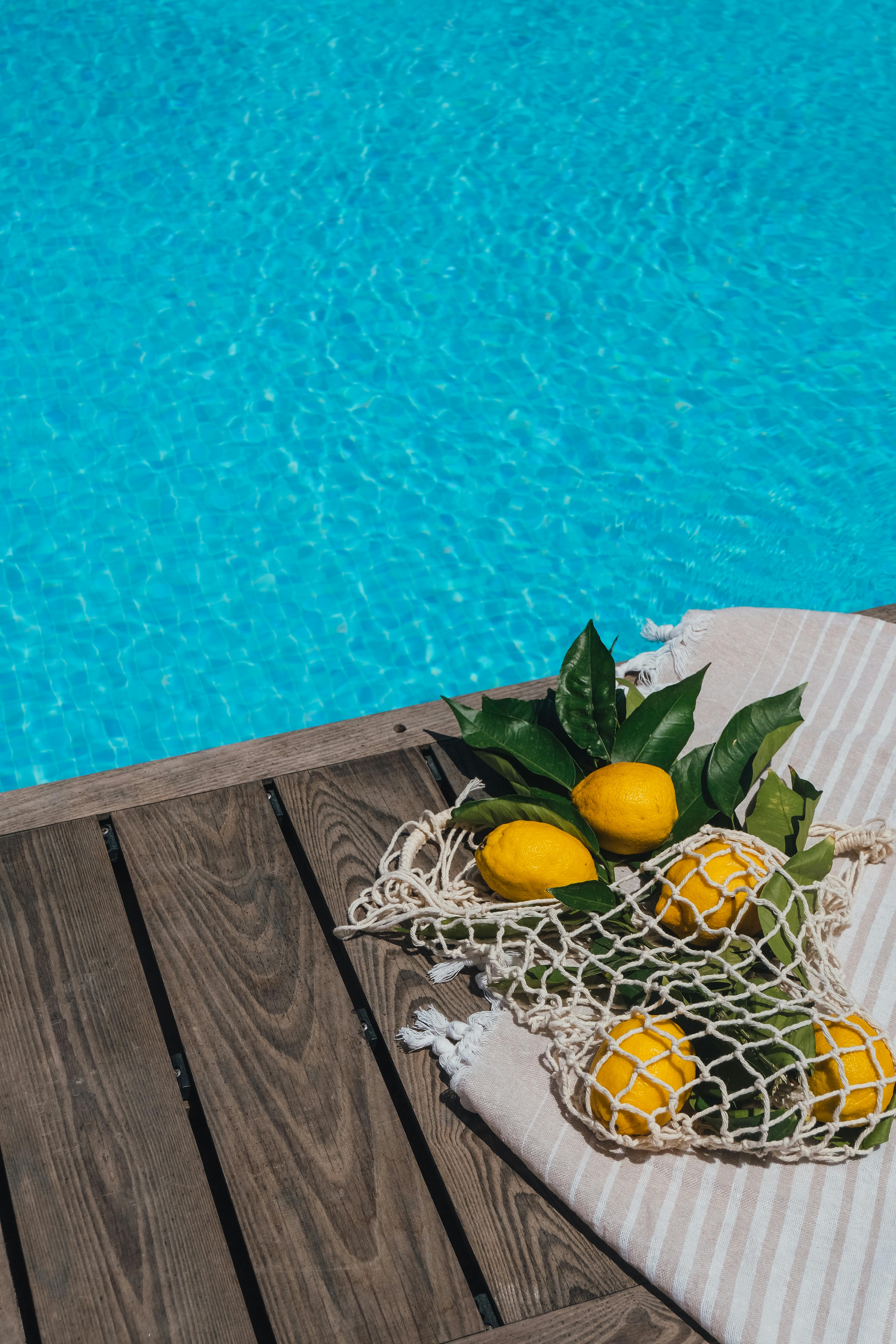 Lemons by a Swimming Pool · Free Stock Photo