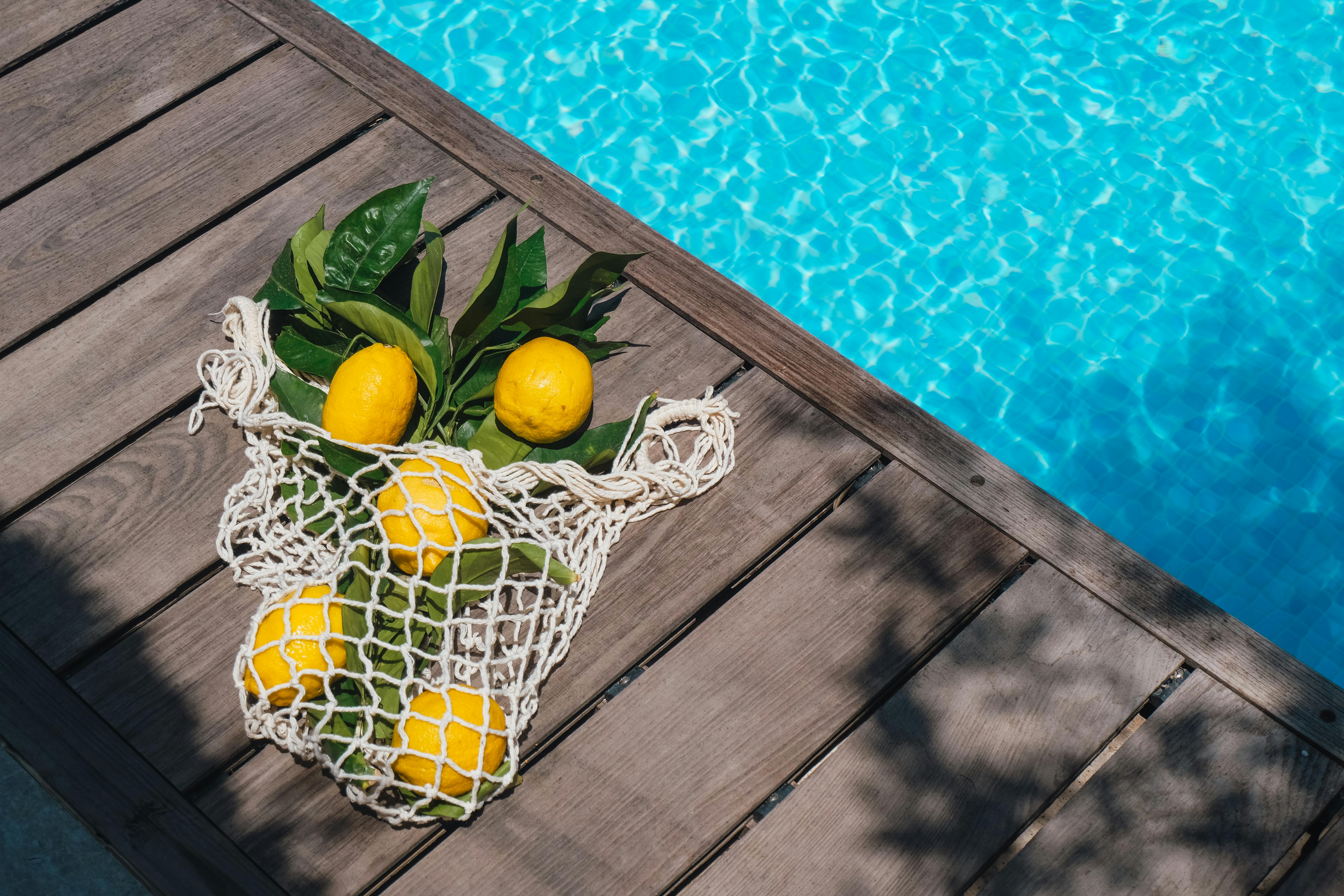 Lemons by a Swimming Pool · Free Stock Photo