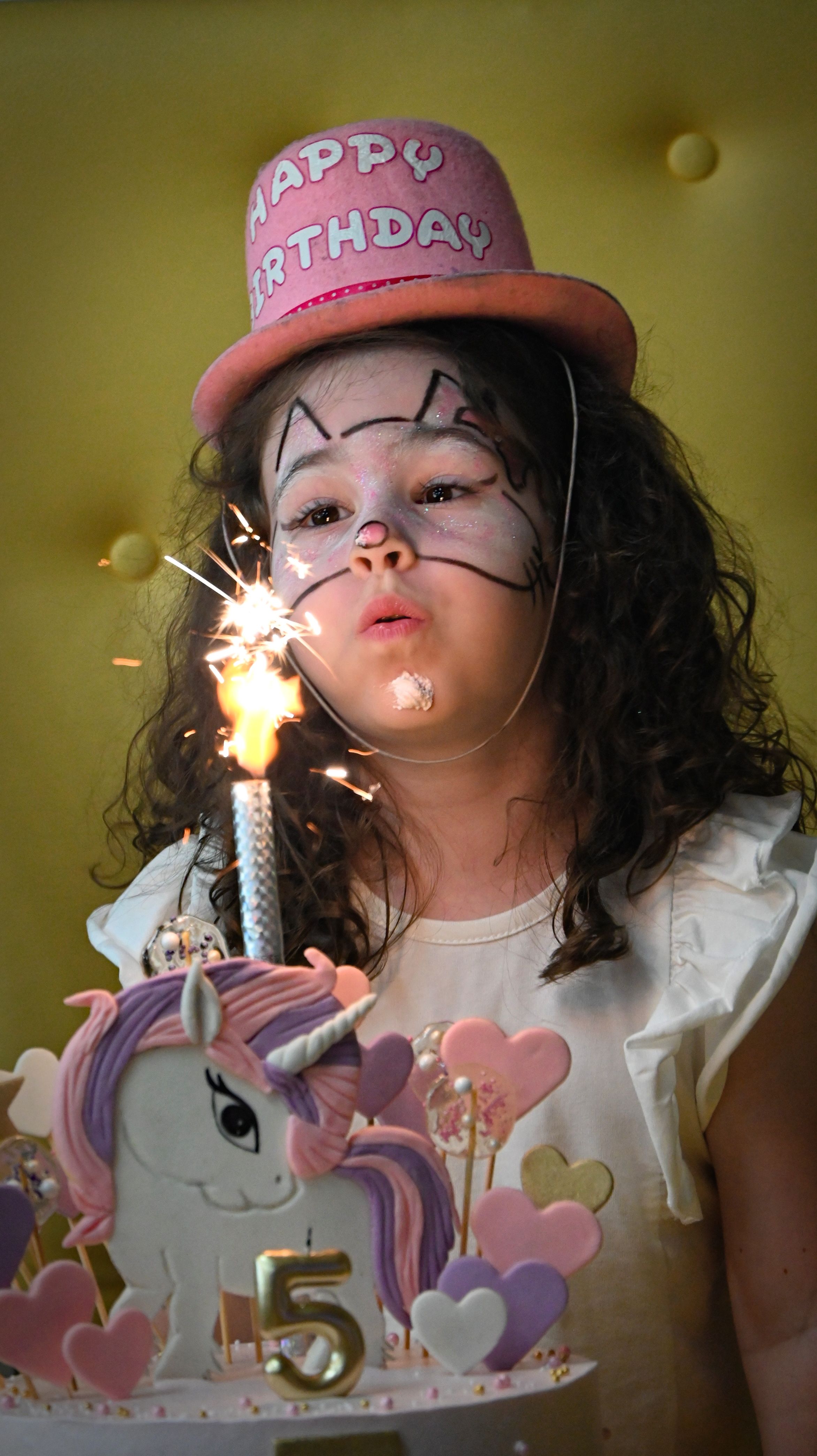 Portrait of Girl Blowing Candle on Cake · Free Stock Photo