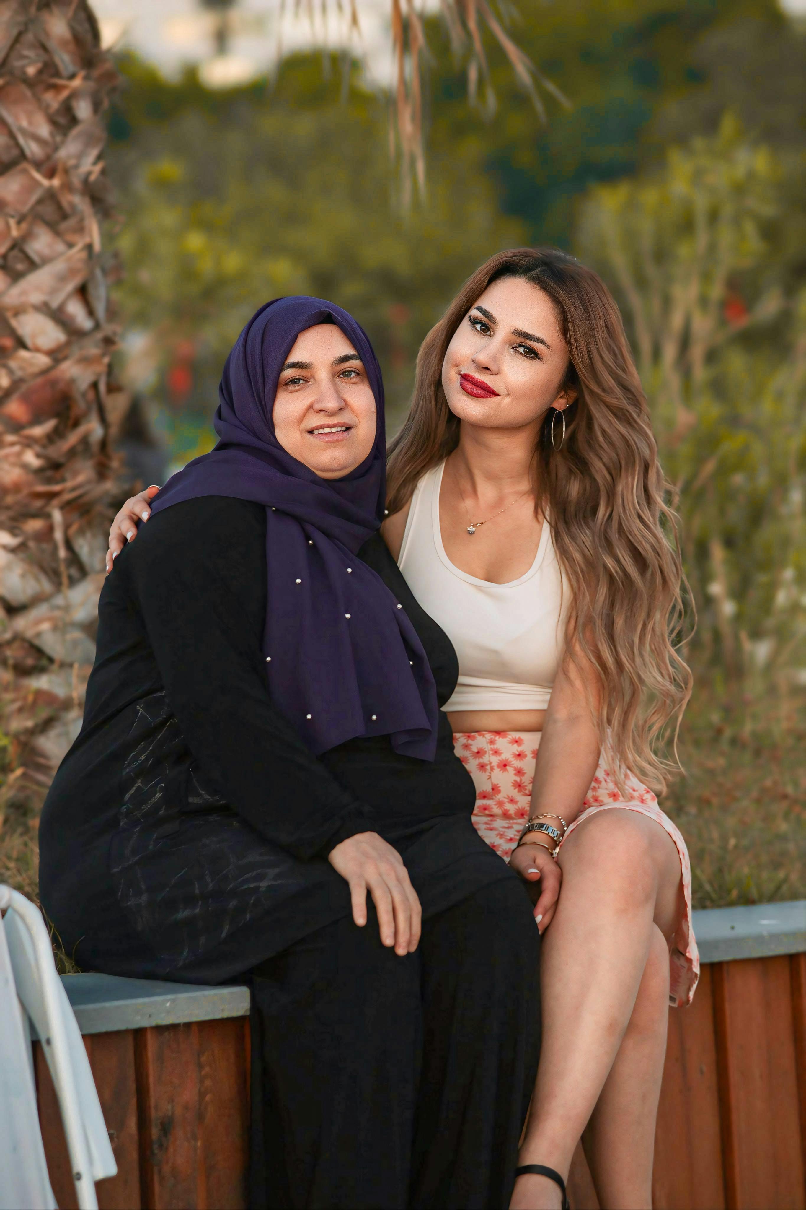 Two women in hijab pose for a photo · Free Stock Photo