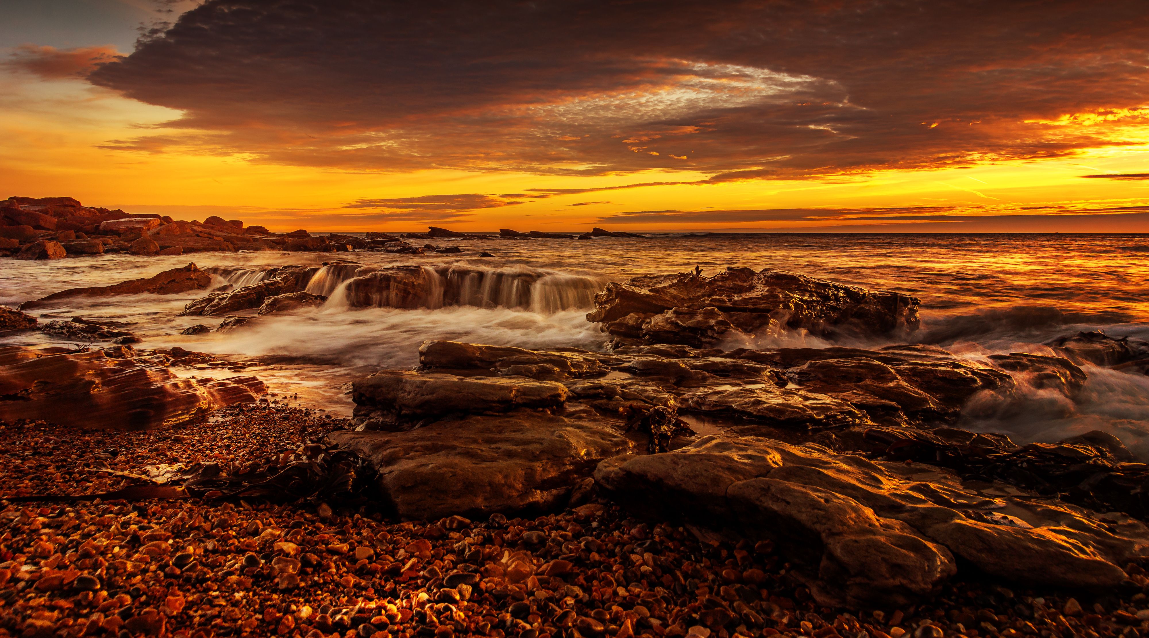 Rocks on Barren Sea Shore at Sunset · Free Stock Photo