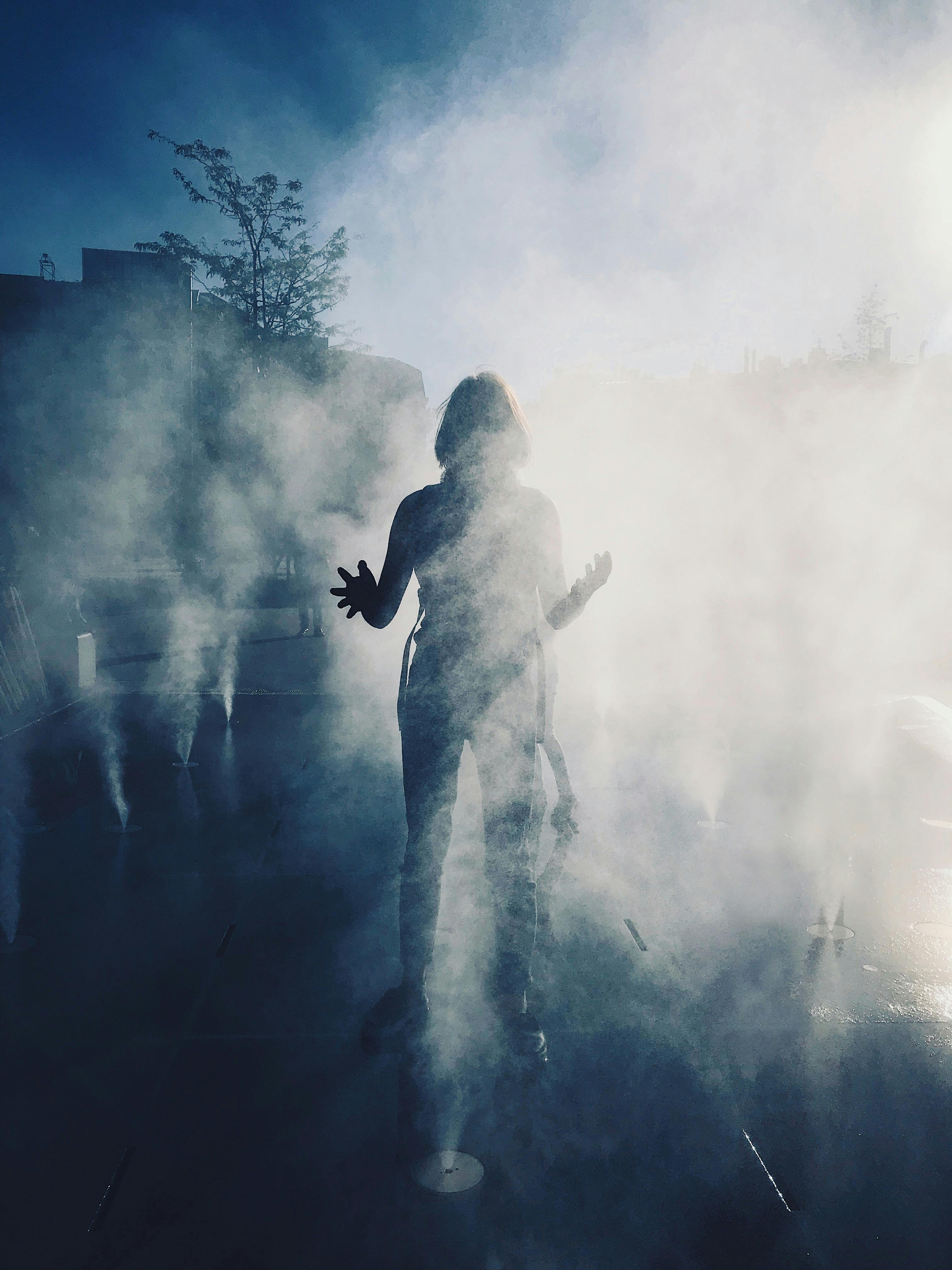 person Standing Near Smoke · Free Stock Photo