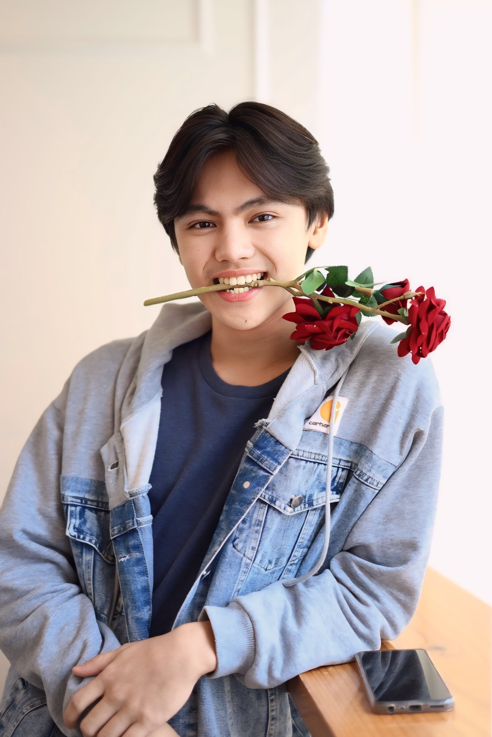 A Boy Holding a Red Rose between His Teeth · Free Stock Photo